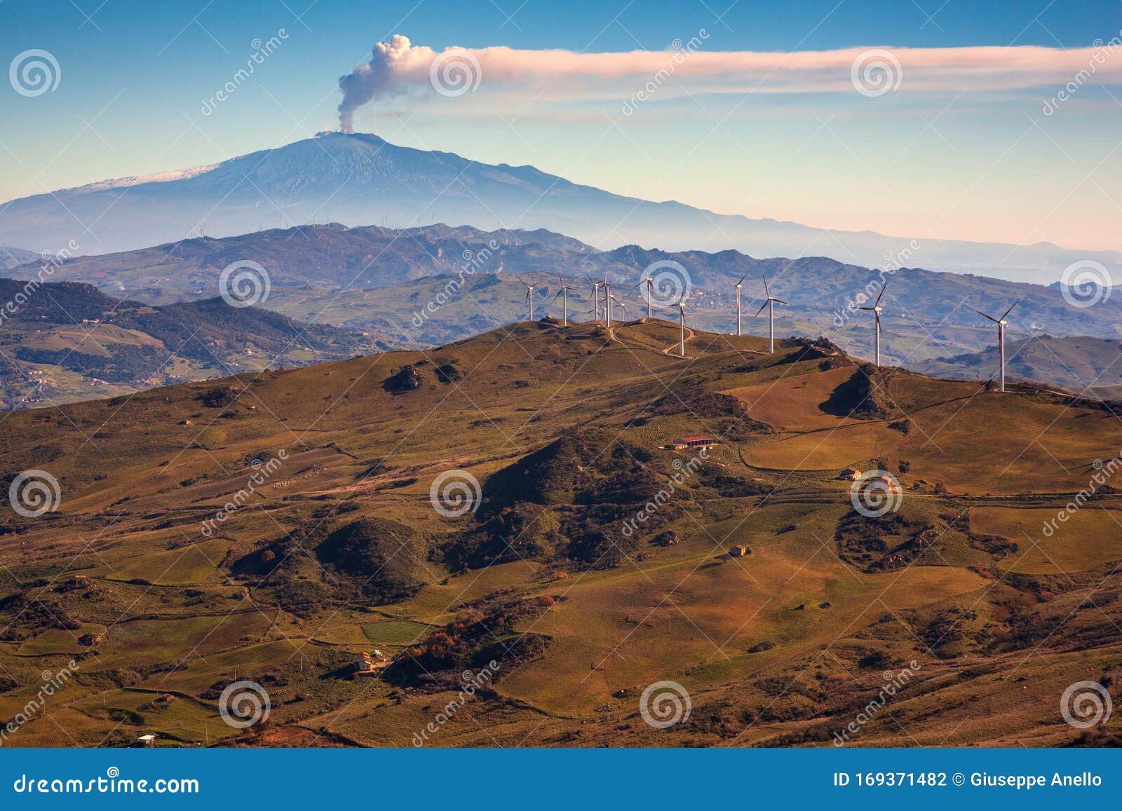 View of Windmills and the Mount Etna Volcano Stock Photo - Image of ...