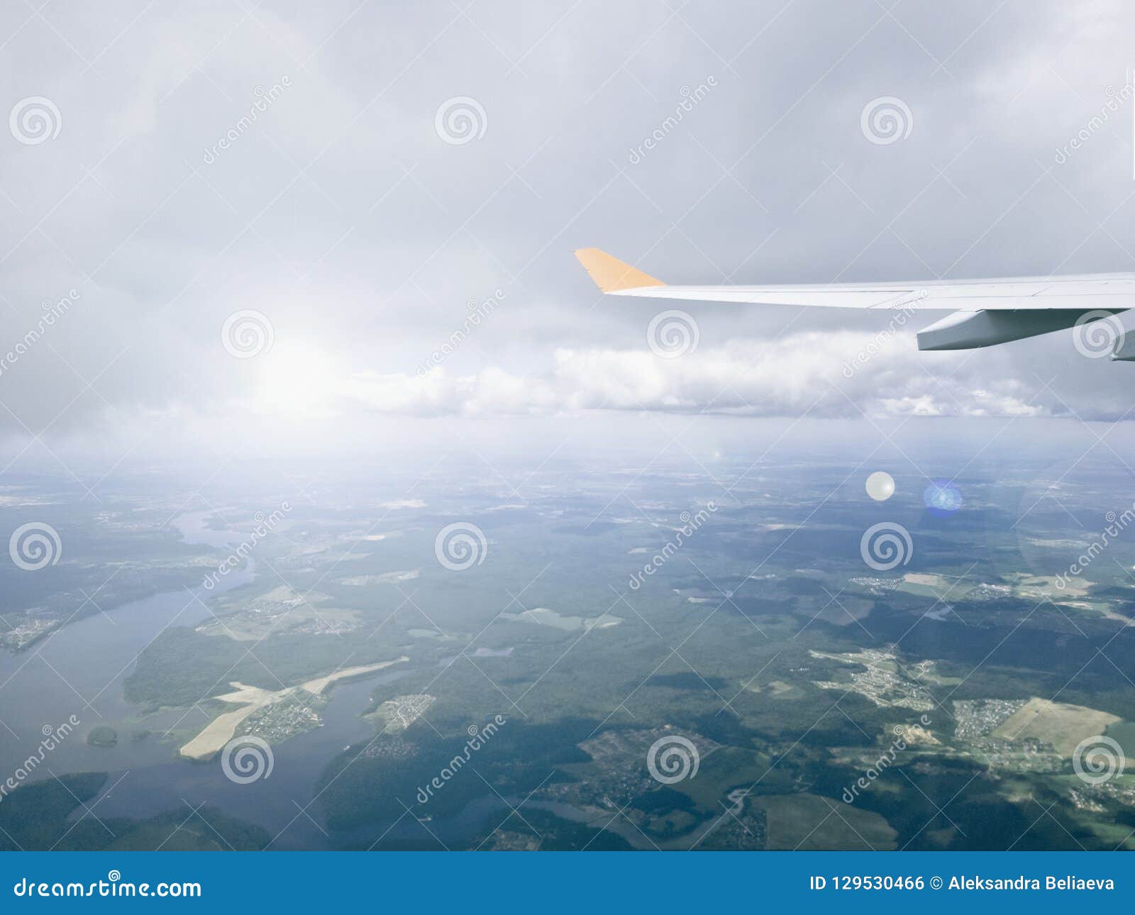 View from the Window of the Aircraft on the Endless Fields and Forests ...
