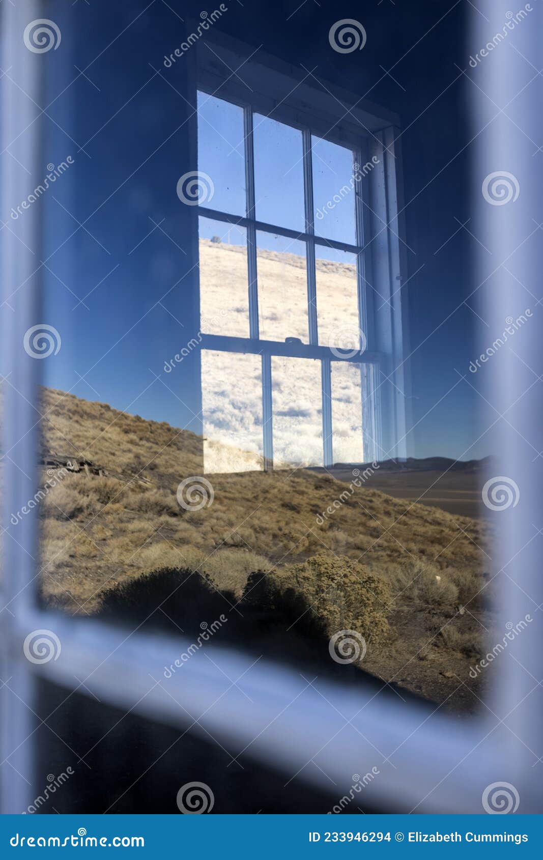 View of a Window Frame through a Window with a Desert Reflection Scene ...