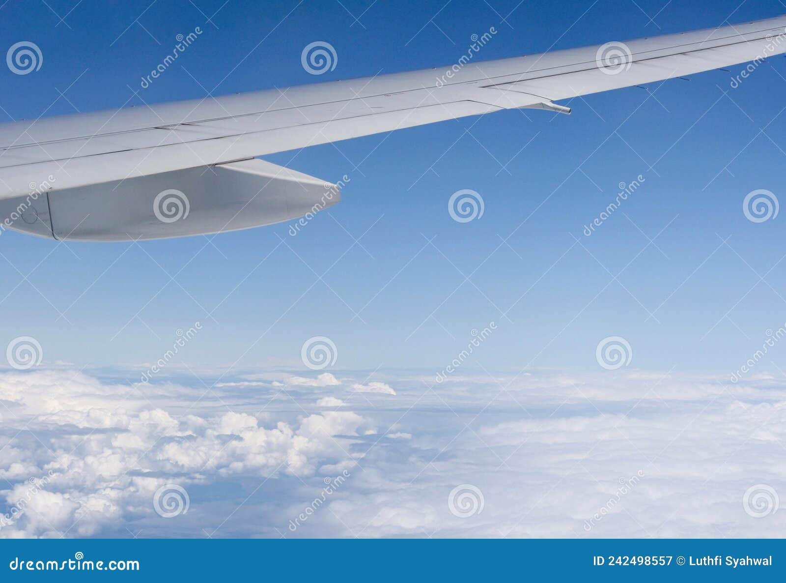 View of Wing of Airplane with Open Flaps from Window with Blue Sky ...