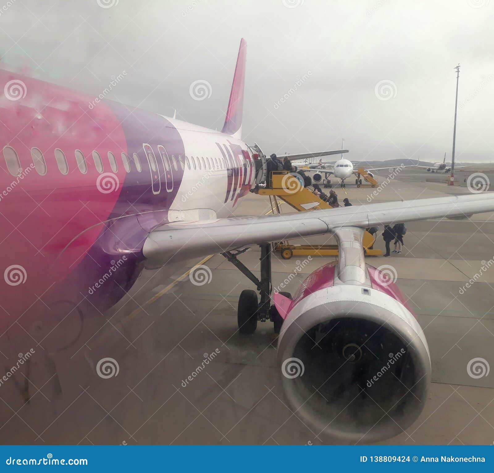 View of the Wing of the Plane Taking Off through the Window, from the ...
