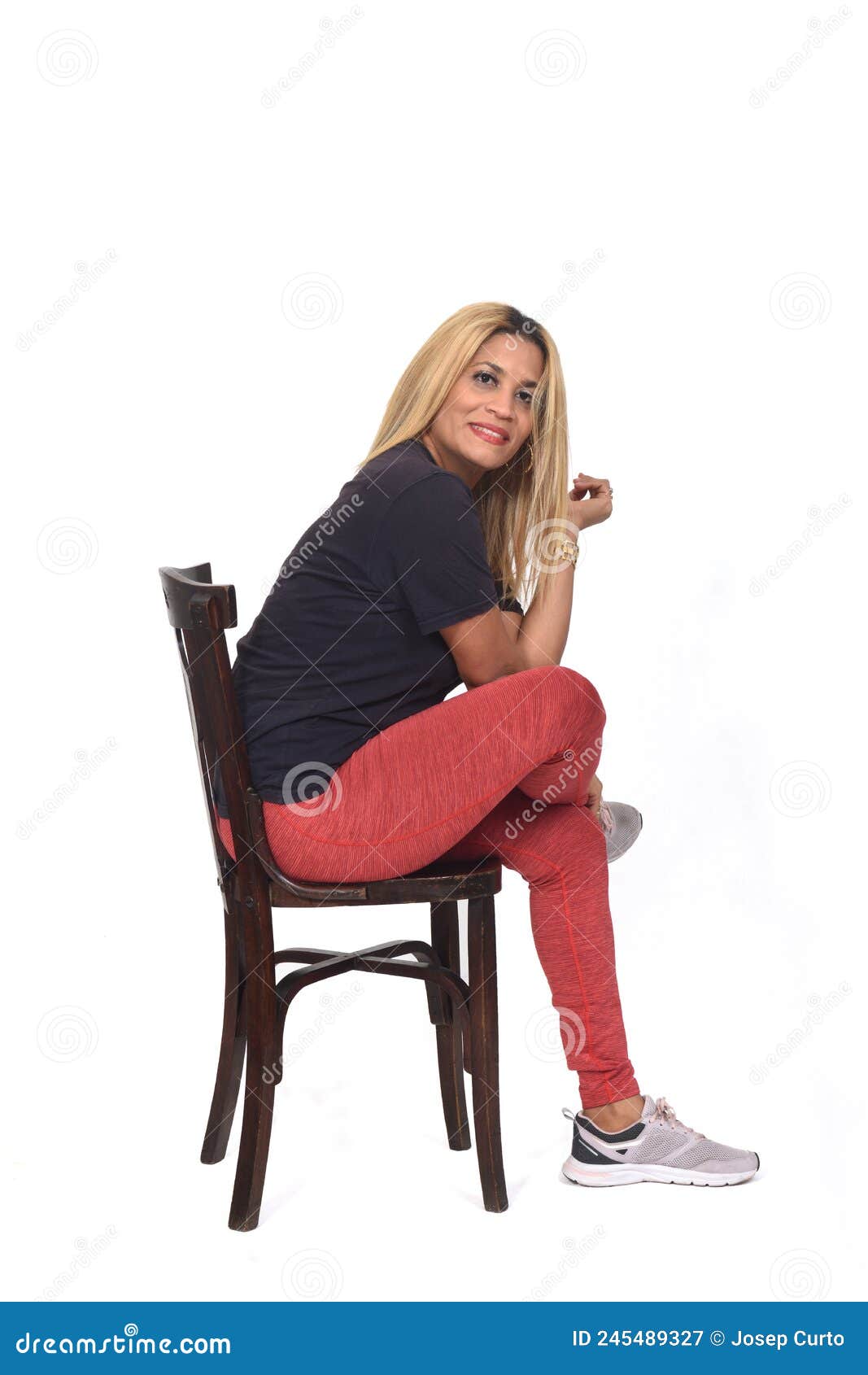 View Of A Woman Sitting On Chair On White Background Stock Image