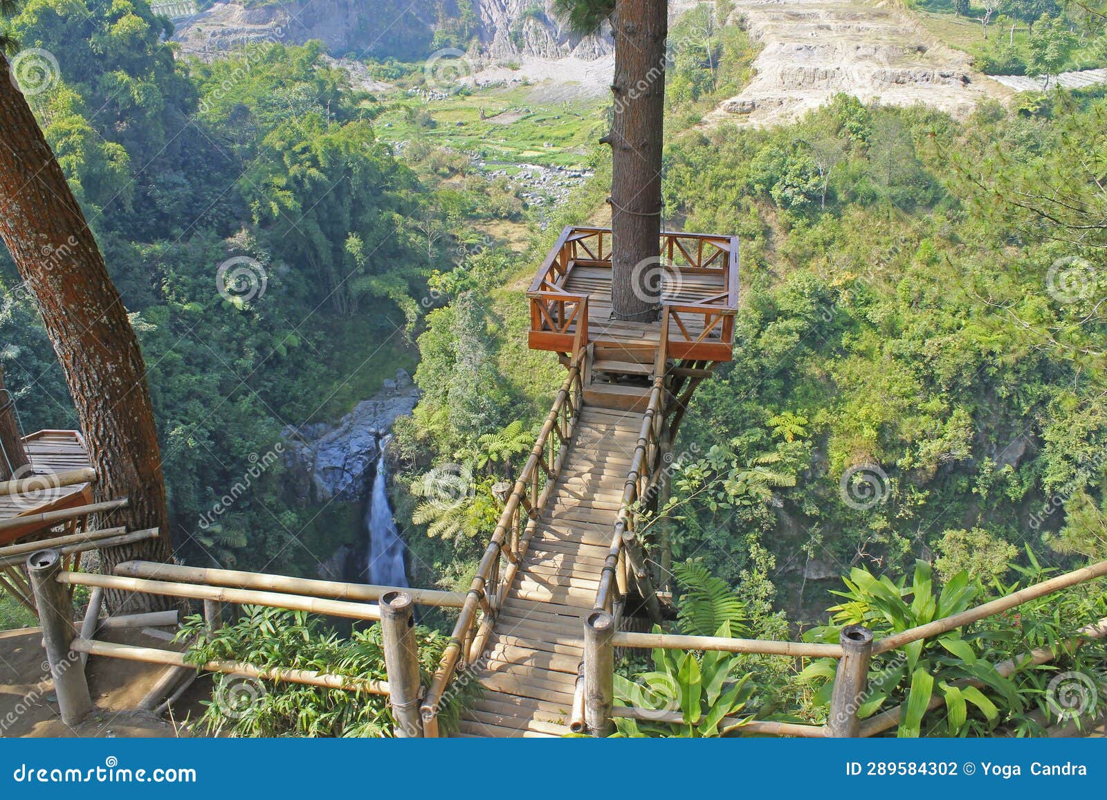 View of the Wooden Bridge with the Waterfall Below Stock Photo - Image ...