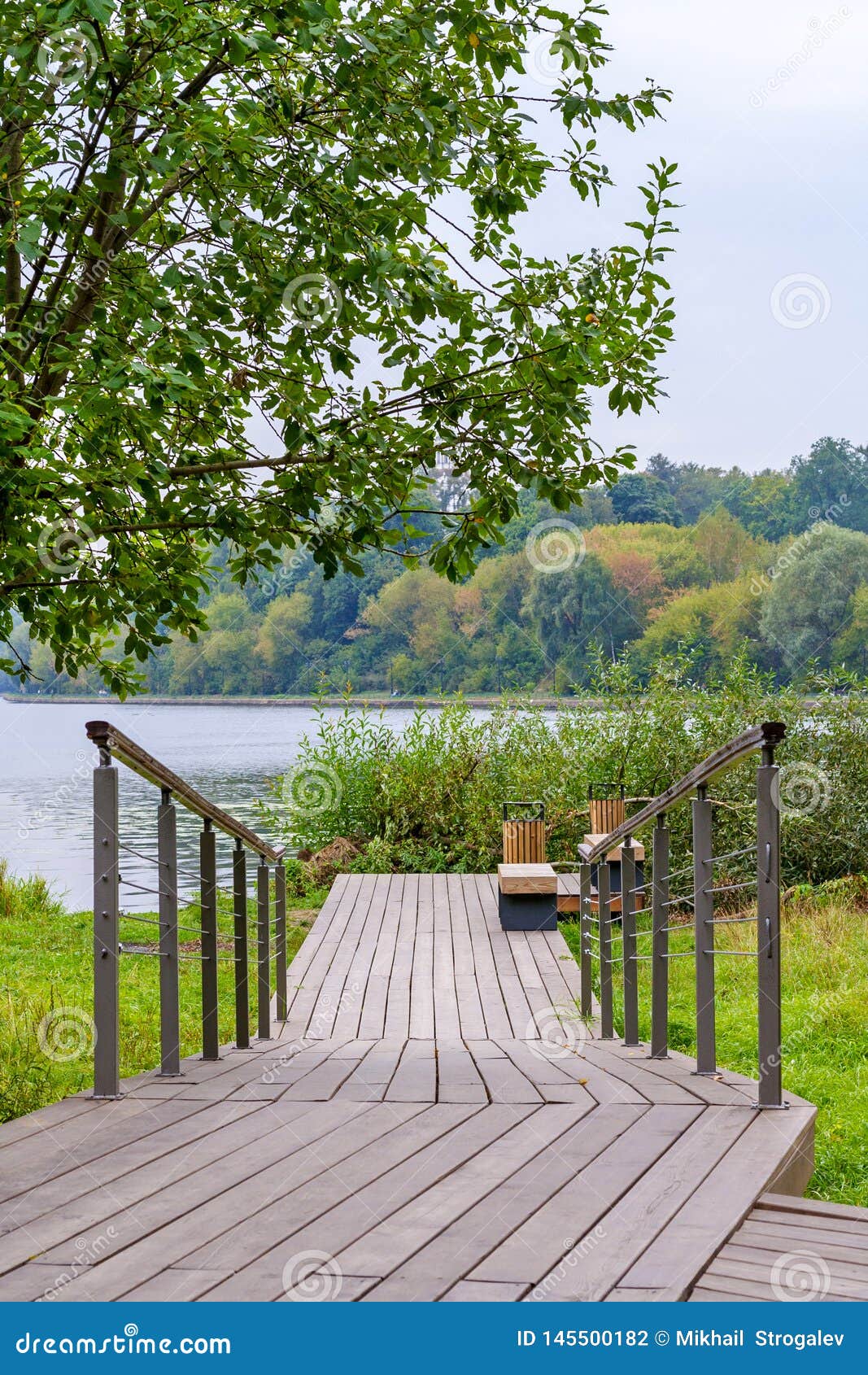 A Wooden Walking Path with Handrails in Park on the River Coast Stock ...