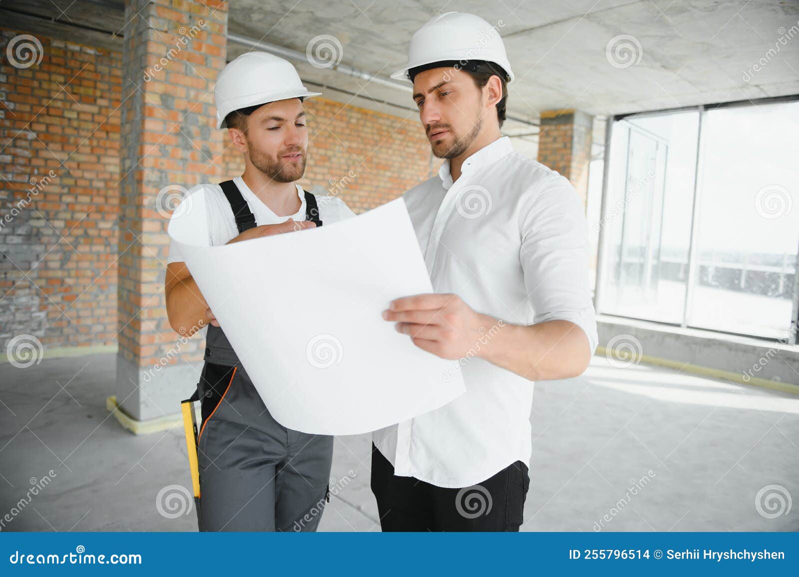 View of a Worker and Architect Watching Some Details on a Construction ...