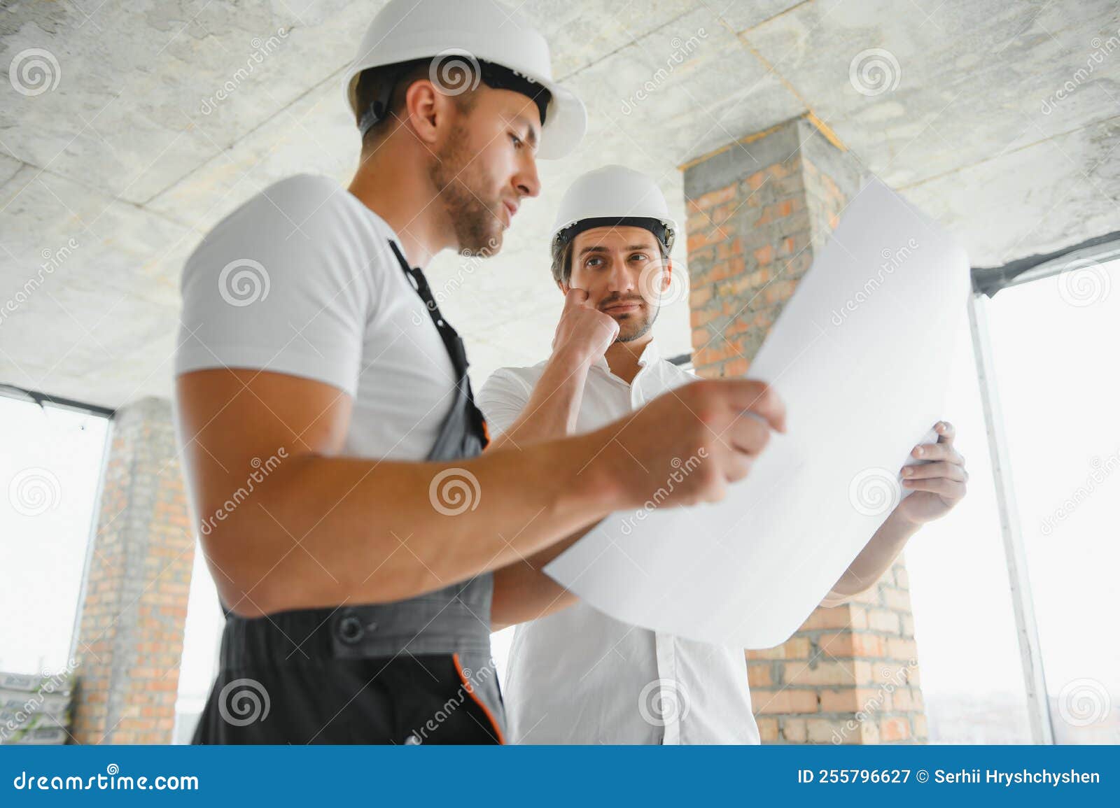 View of a Worker and Architect Watching Some Details on a Construction ...