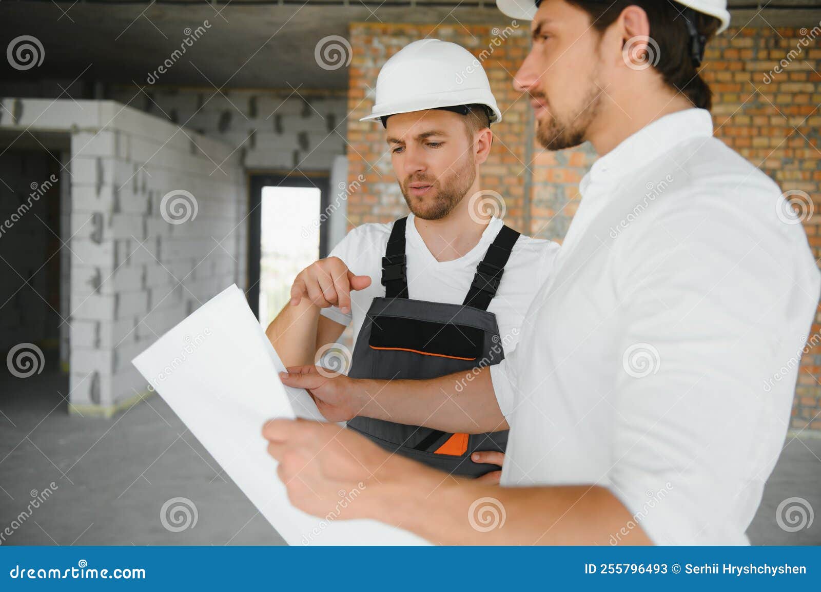 View of a Worker and Architect Watching Some Details on a Construction ...