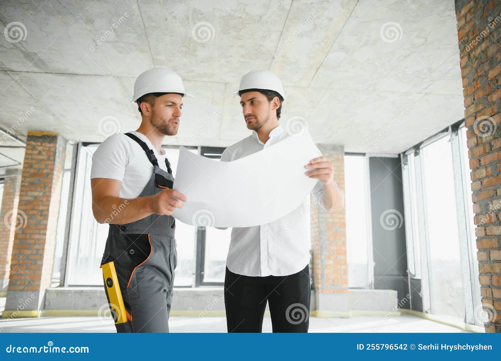 View of a Worker and Architect Watching Some Details on a Construction ...