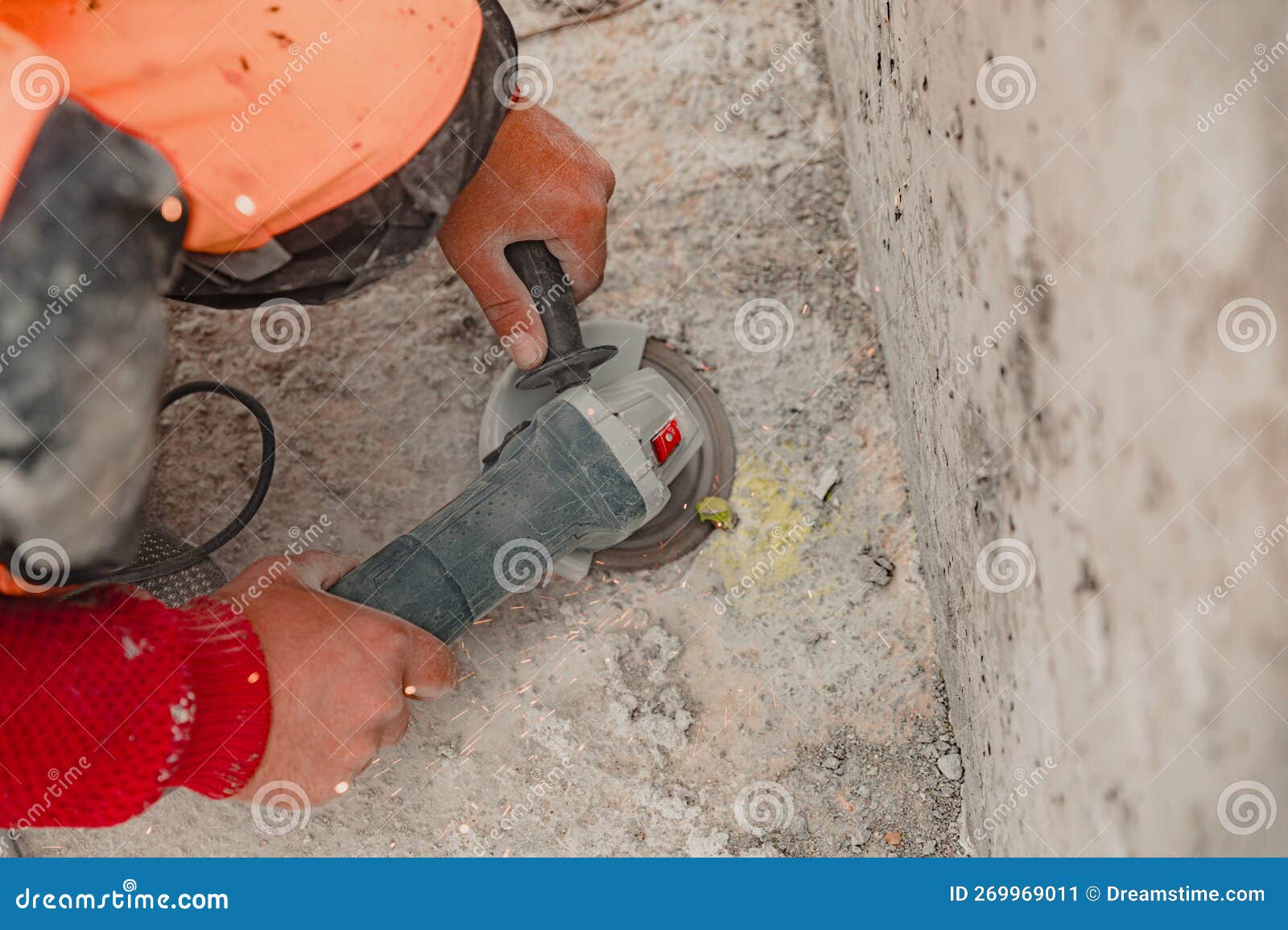 View of a Worker at a Construction Site Working with a Rock-drill and ...