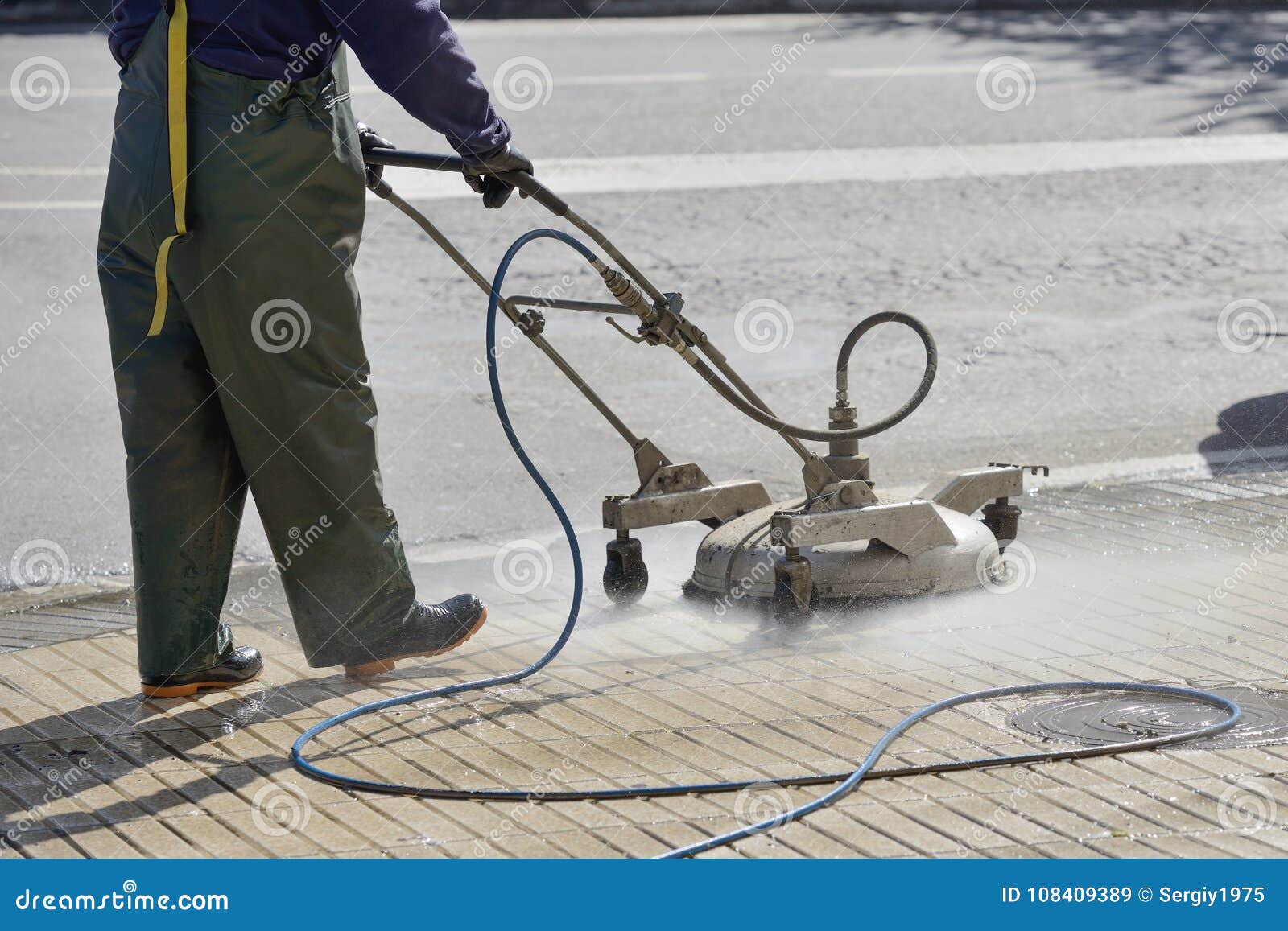Worker washes the pavement stock image. Image of city - 108409389