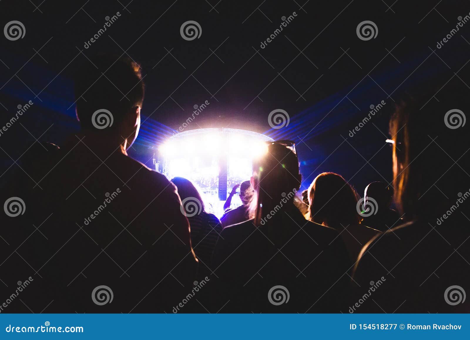 Viewers Watch a Rock Band Perform on Stage. Stock Image - Image of ...