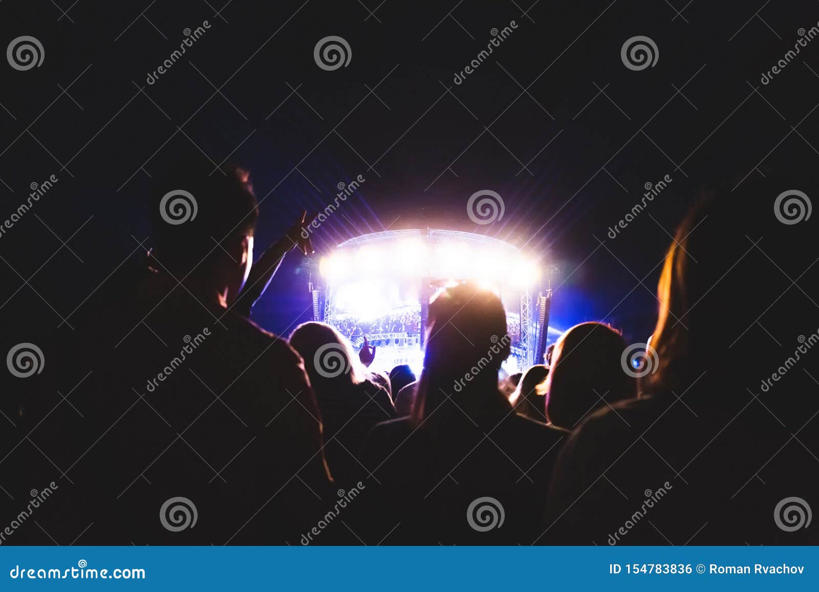 Viewers Watch a Rock Band Perform on Stage. Stock Photo - Image of ...
