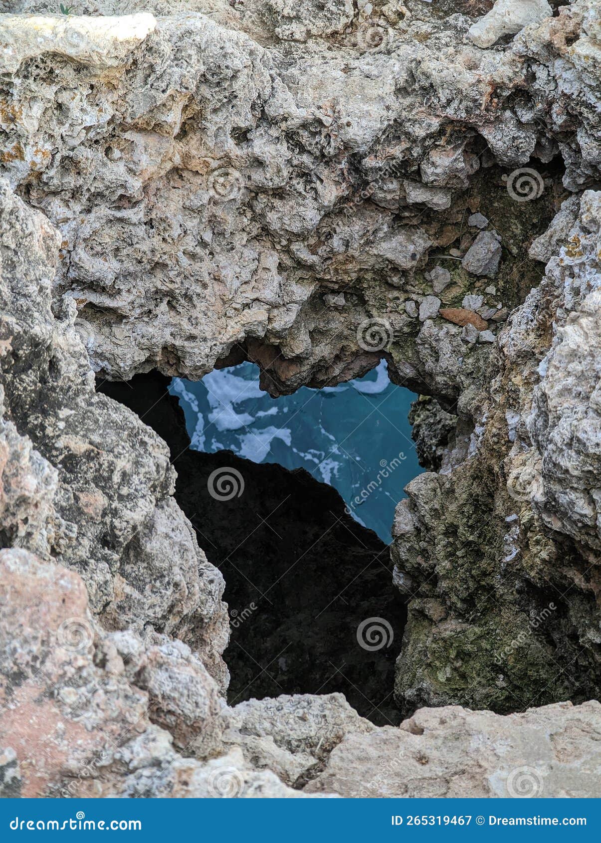 Viewing the Ocean through a Hole in the Rocks Stock Image - Image of ...