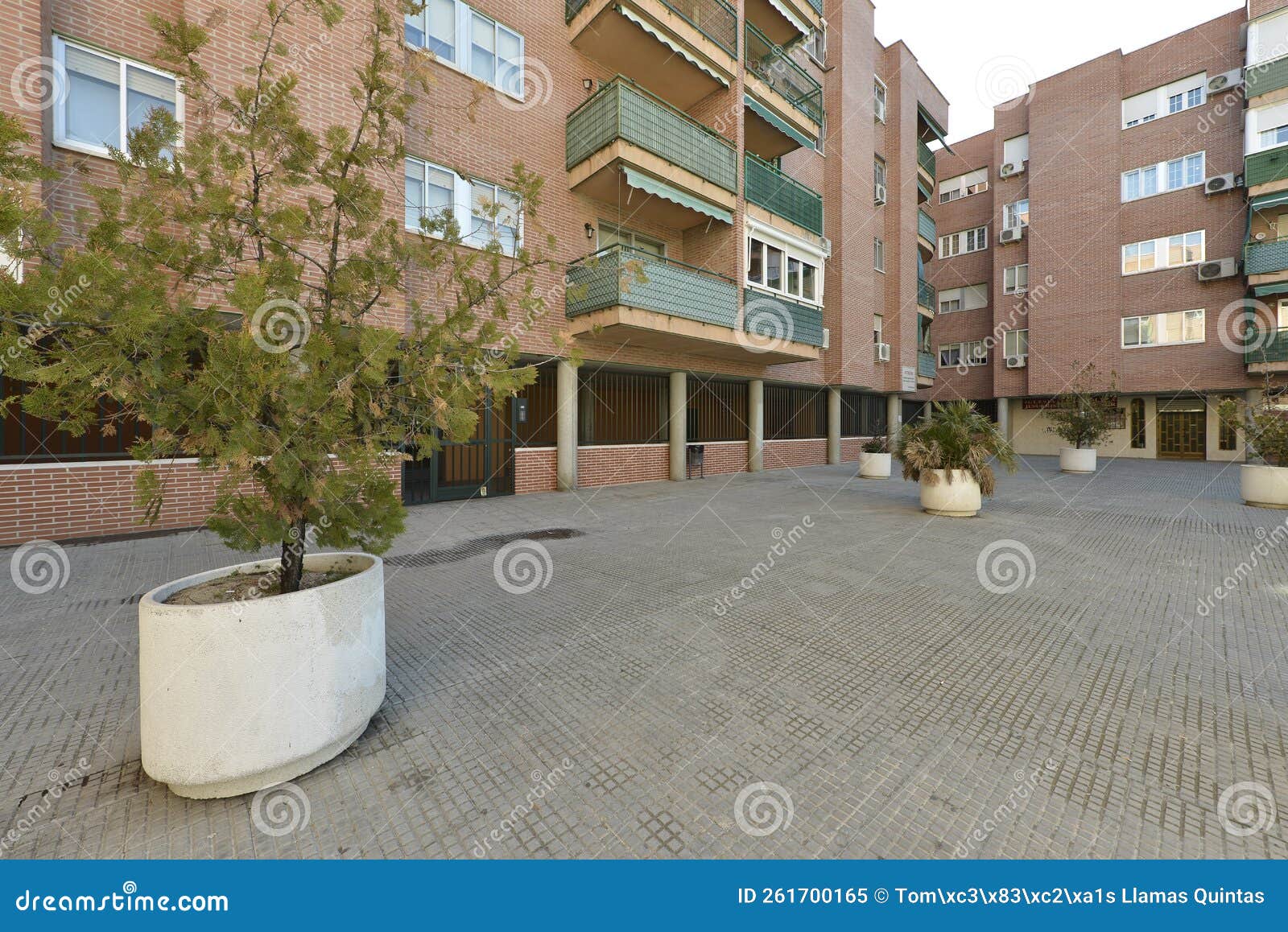 Views of Brick Building Facades and a Public Square with Circular ...