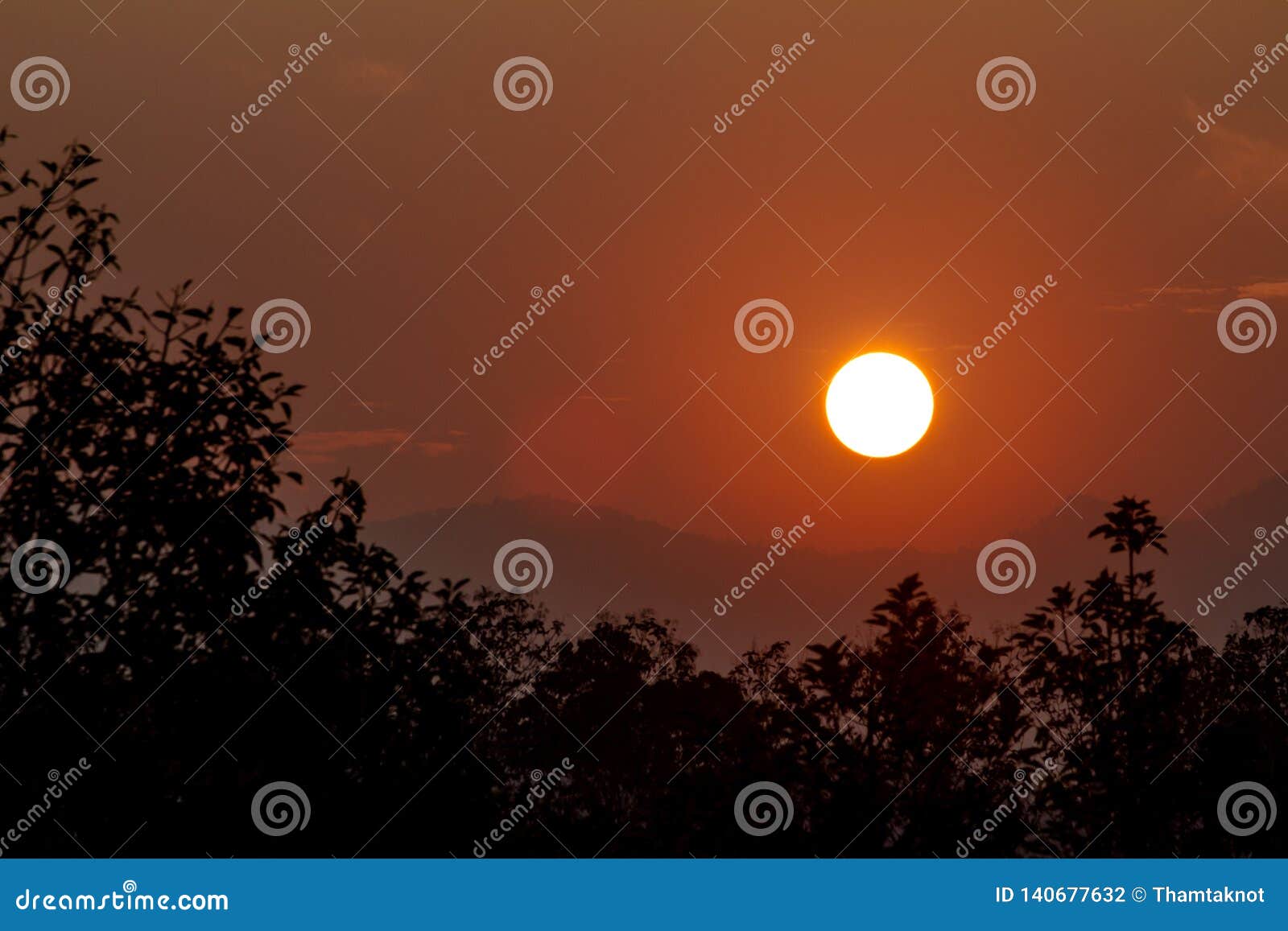 View Images of the Sun Falling Behind the Mountains. Stock Photo ...