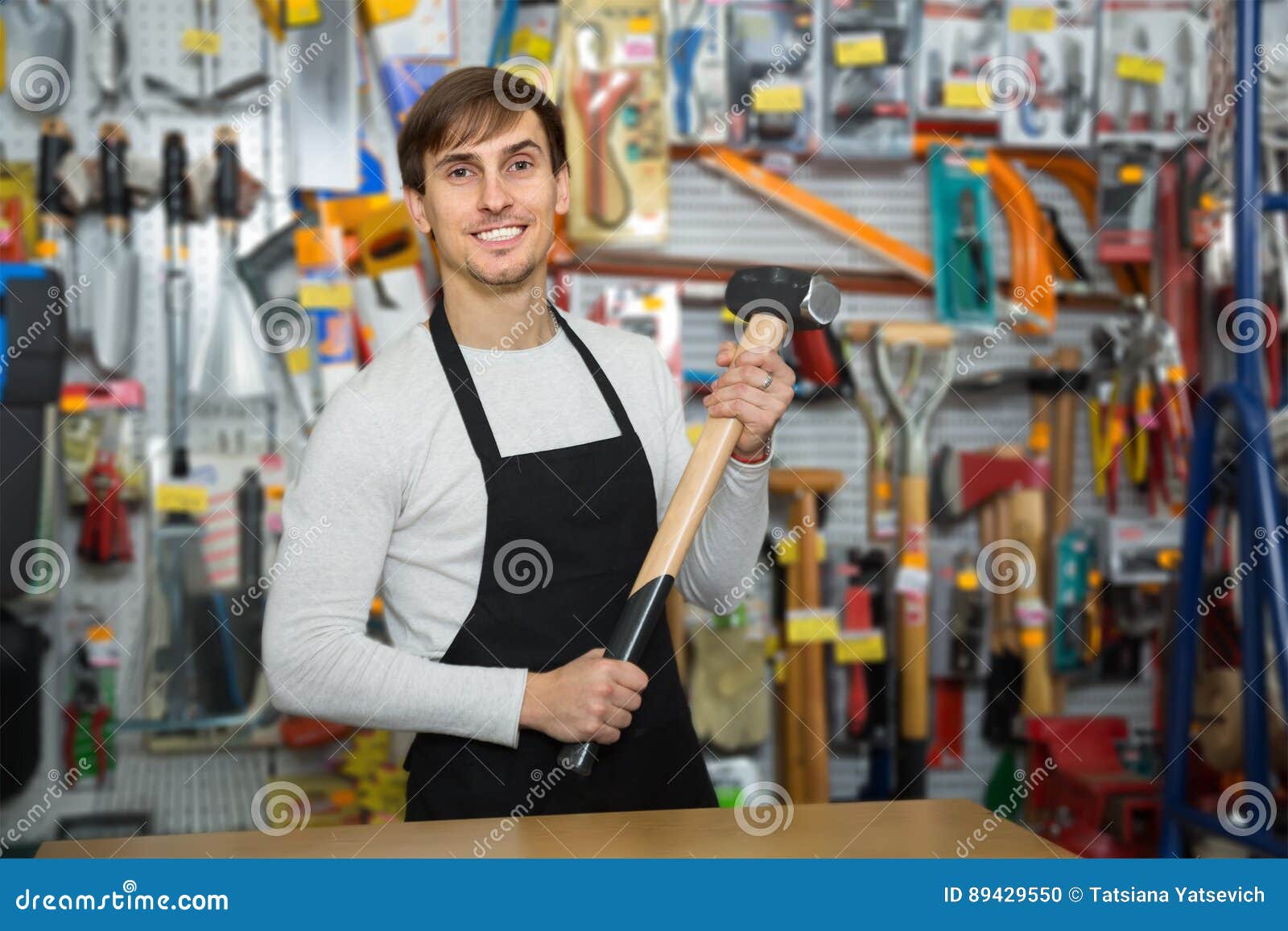 Vigorous Young Salesman in Apron with Tools Stock Photo - Image of ...