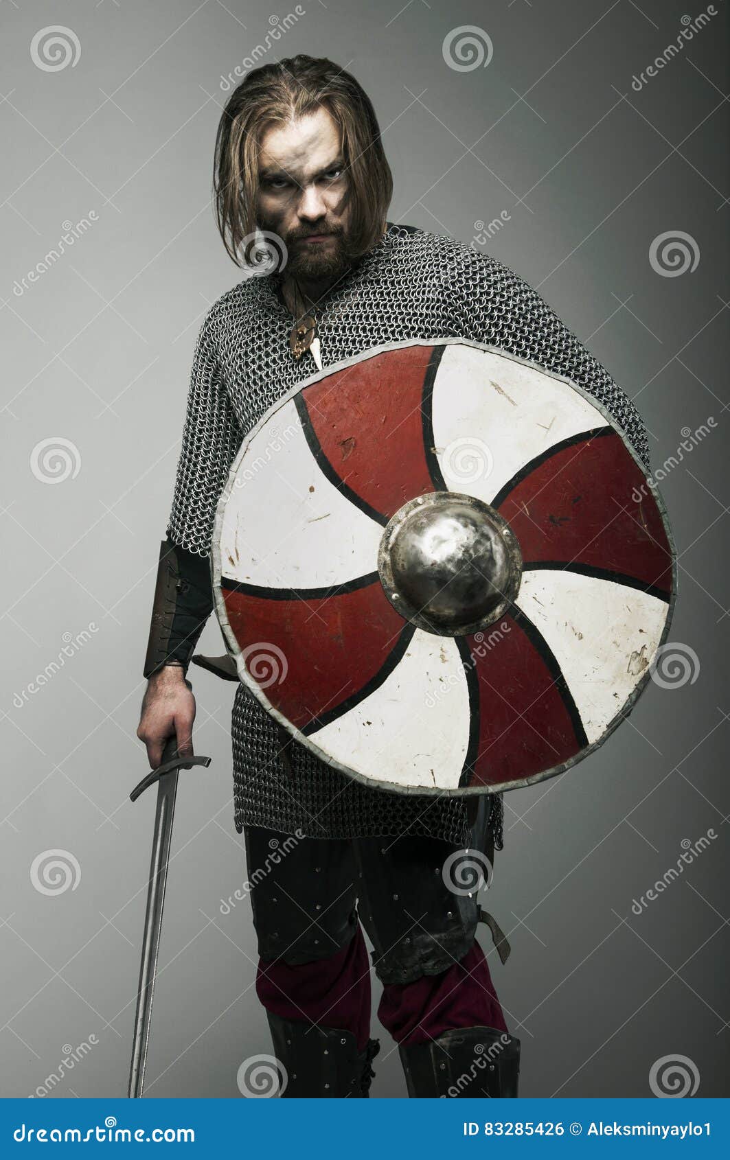 Viking Holding Sword and Shield on the Grey Background Stock Photo ...