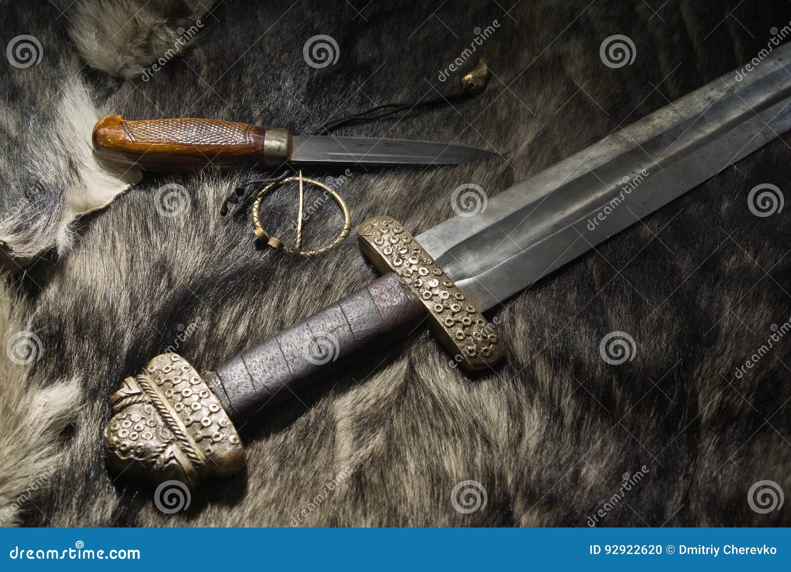 Viking Sword and Knife on a Fur Stock Photo - Image of engagement ...