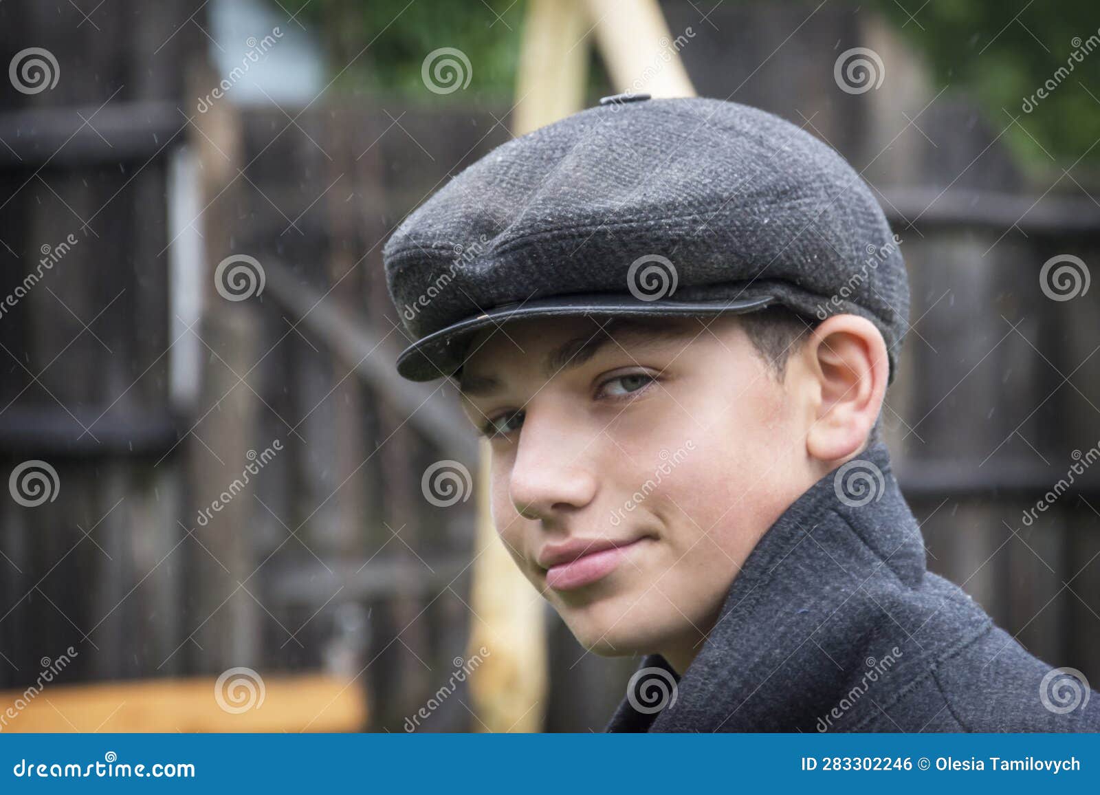 In the Village on a Rainy Day, a Handsome Guy in a Cap and Coat Stock ...