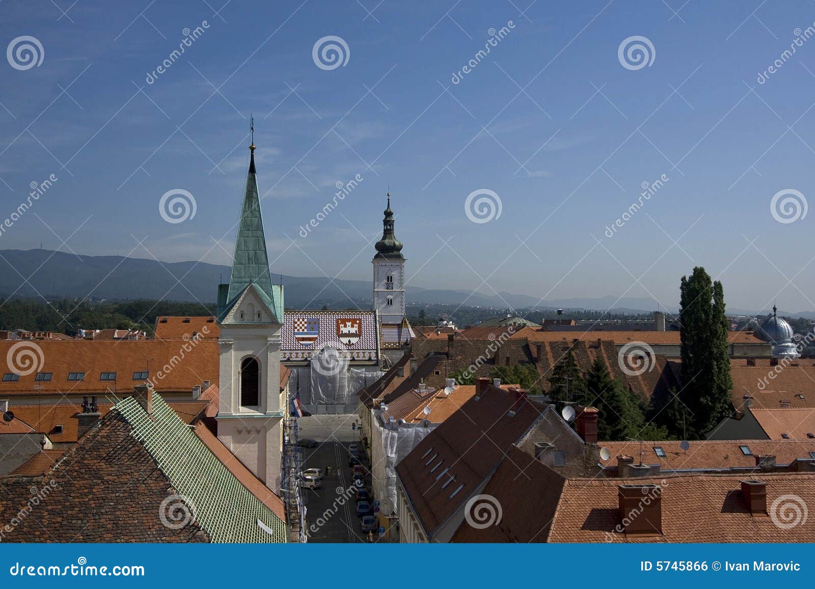 Village rooftops stock photo. Image of blue, tree, cars - 5745866