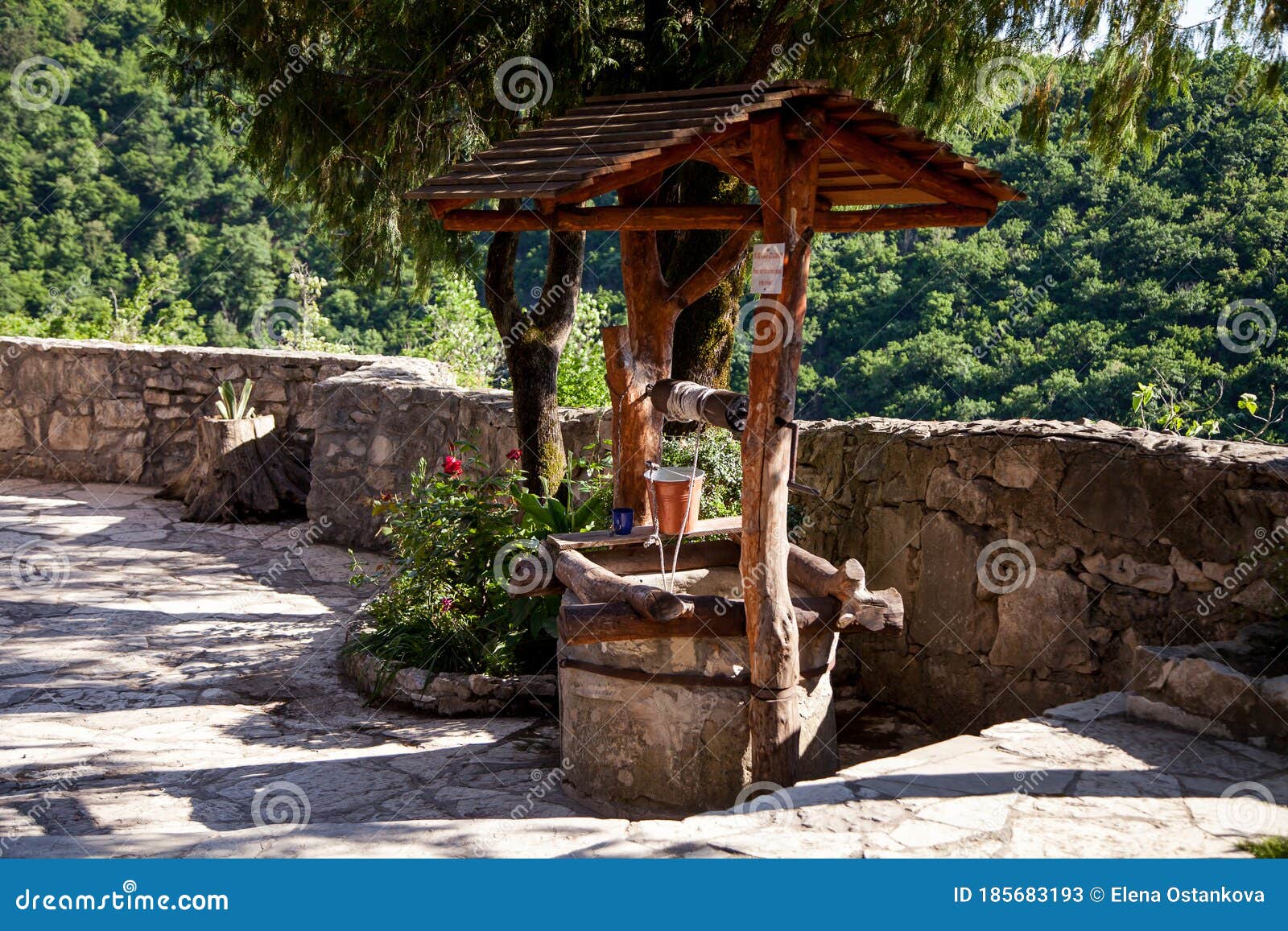 Village well in the yard stock image. Image of country - 185683193