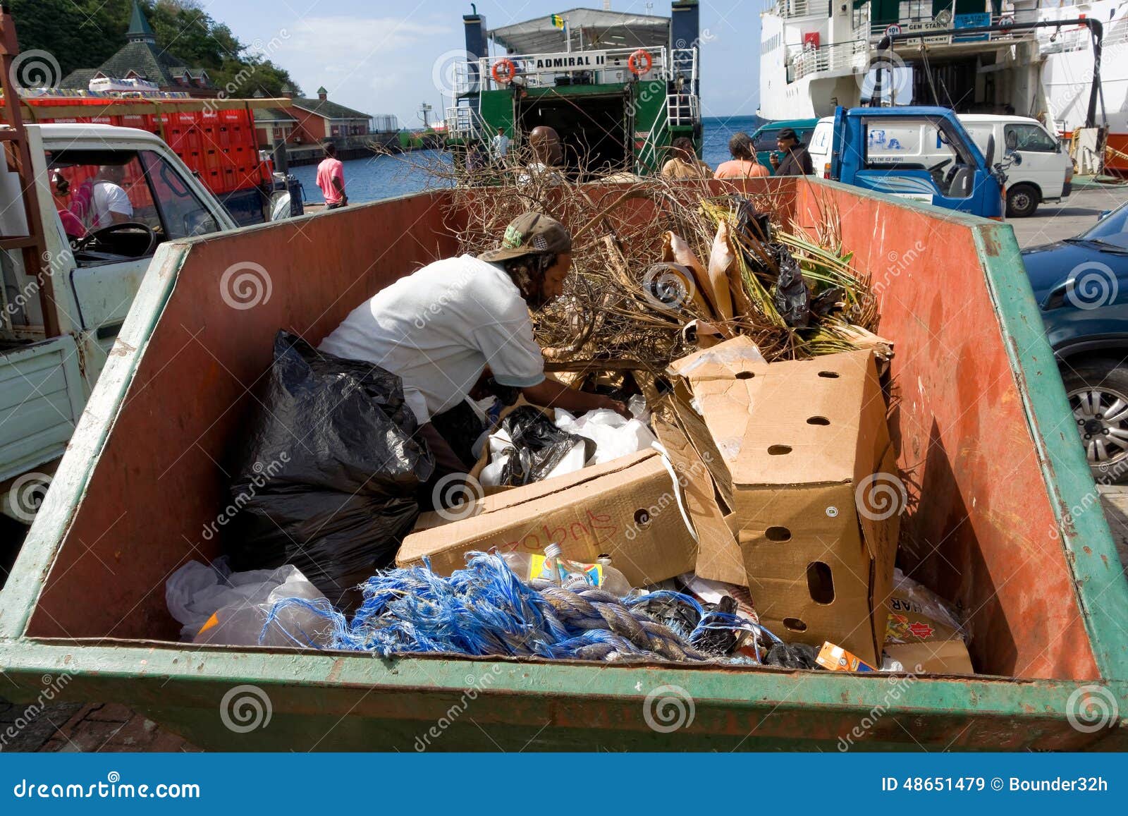 A Vincentian Vagrant Digging Around in a Dumpter Editorial Stock Image ...