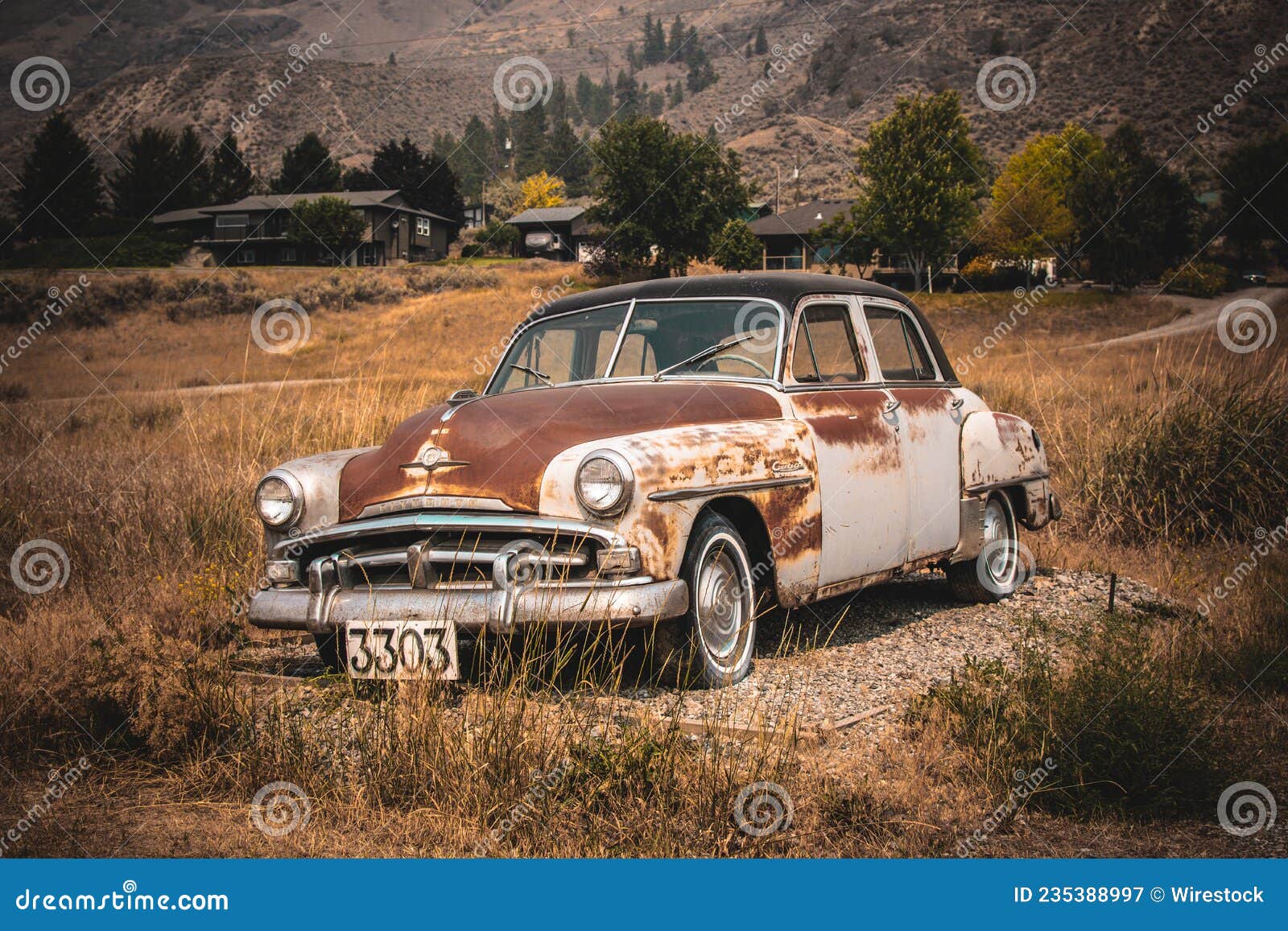 Vintage Abandoned Rusty Car in a Field Under the Sunlight in the ...