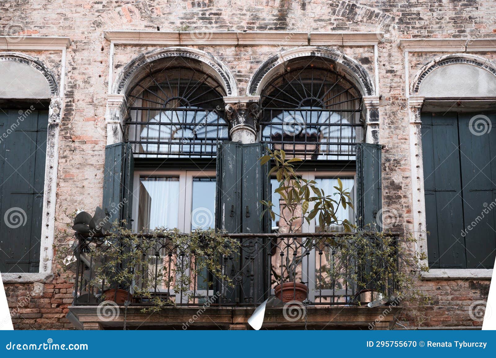 Vintage Arched Windows with Potted Plants. Weathered Brick Wall ...