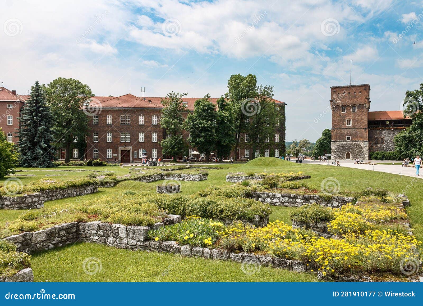 An Old Building with Gardens, and a Walkway between Two Buildings ...