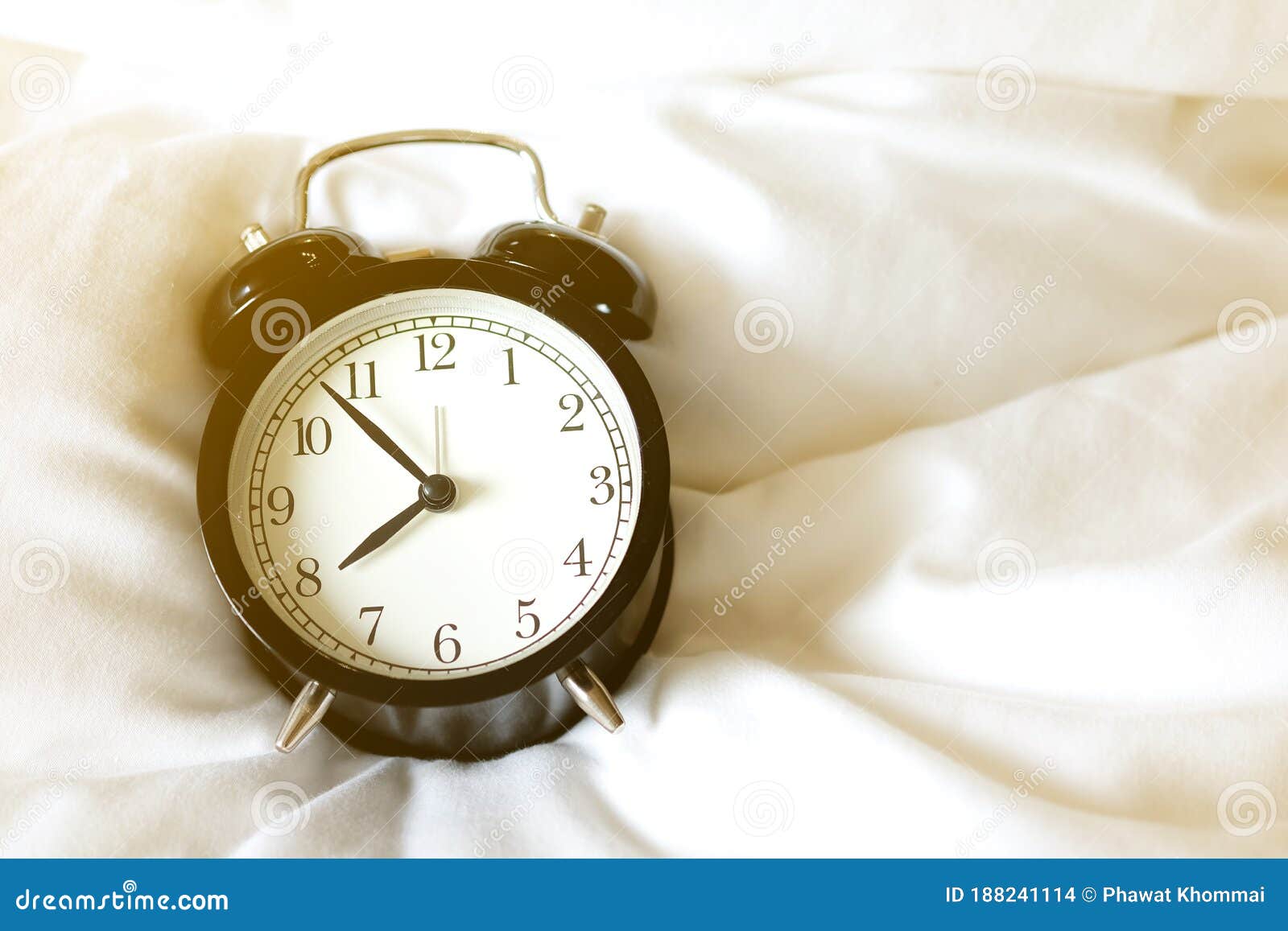 Vintage Black Alarm Clock at 8:00 am on White Bed Stock Photo - Image ...