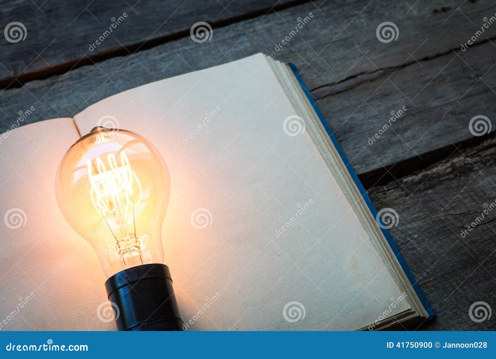 Vintage Book and Light Bulb on Wood Table on White Background Stock ...