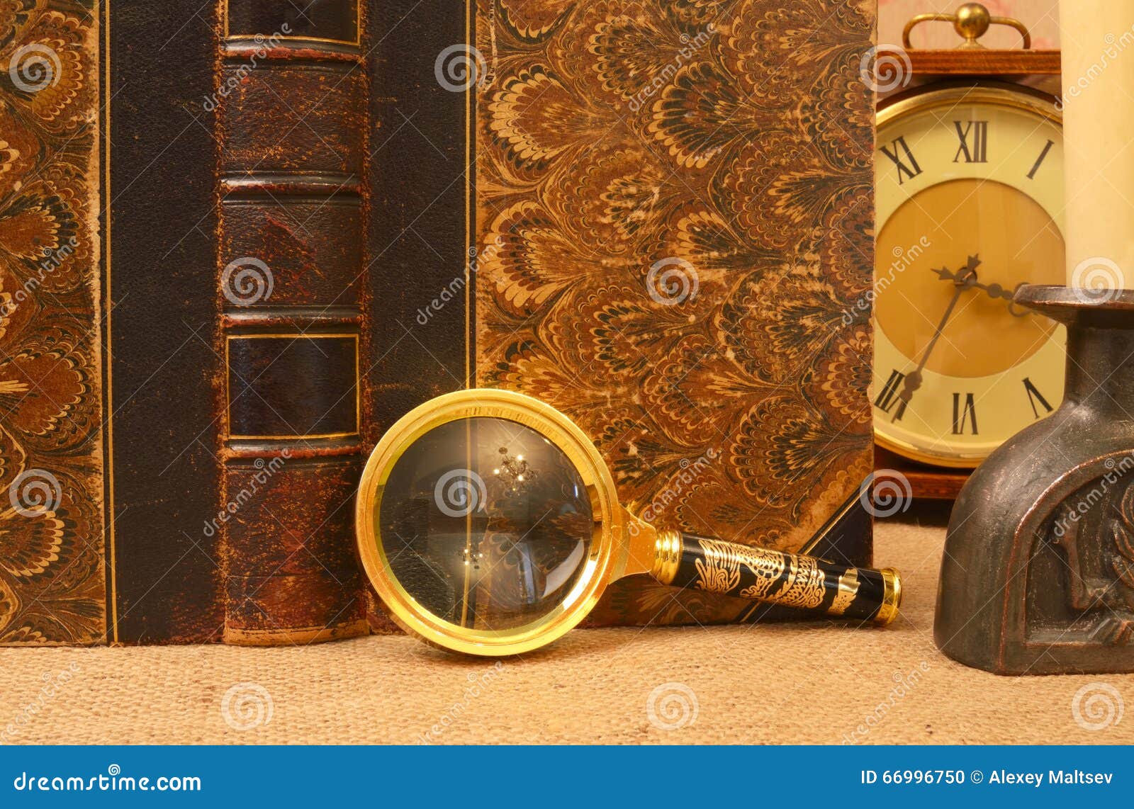Vintage Book, Magnifying Glass, Clocks and Candlestick Stock Photo ...