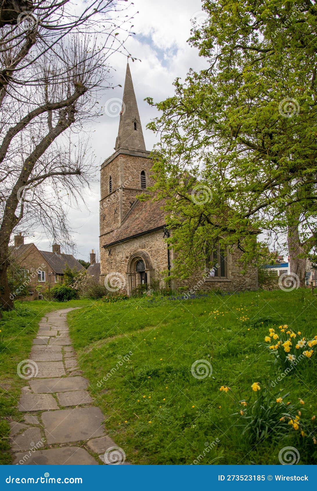 An Old Brick Building that Has a Tower in it with Trees on Each Side of ...