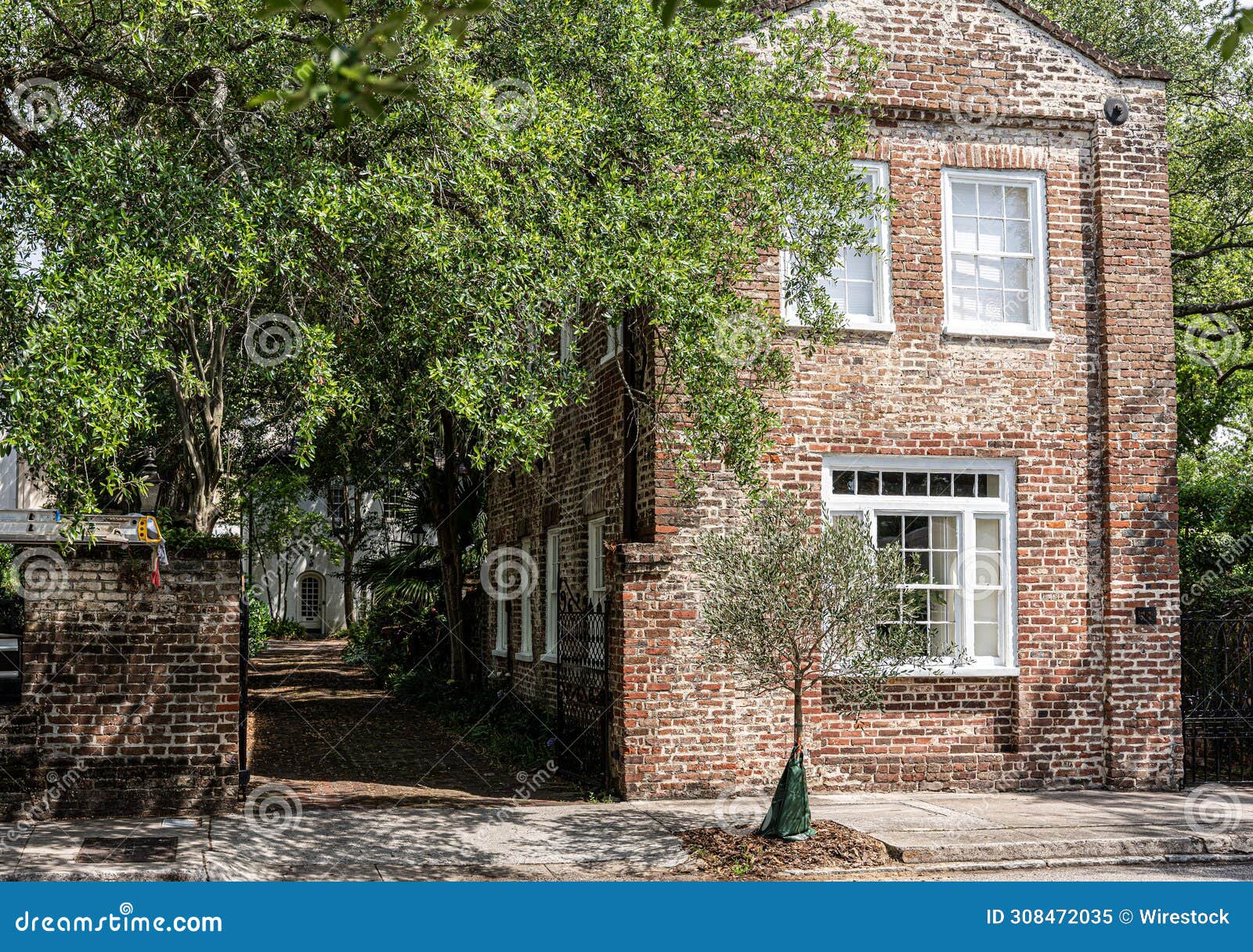 Vintage Brick House with a Tree in Front Stock Image - Image of ...