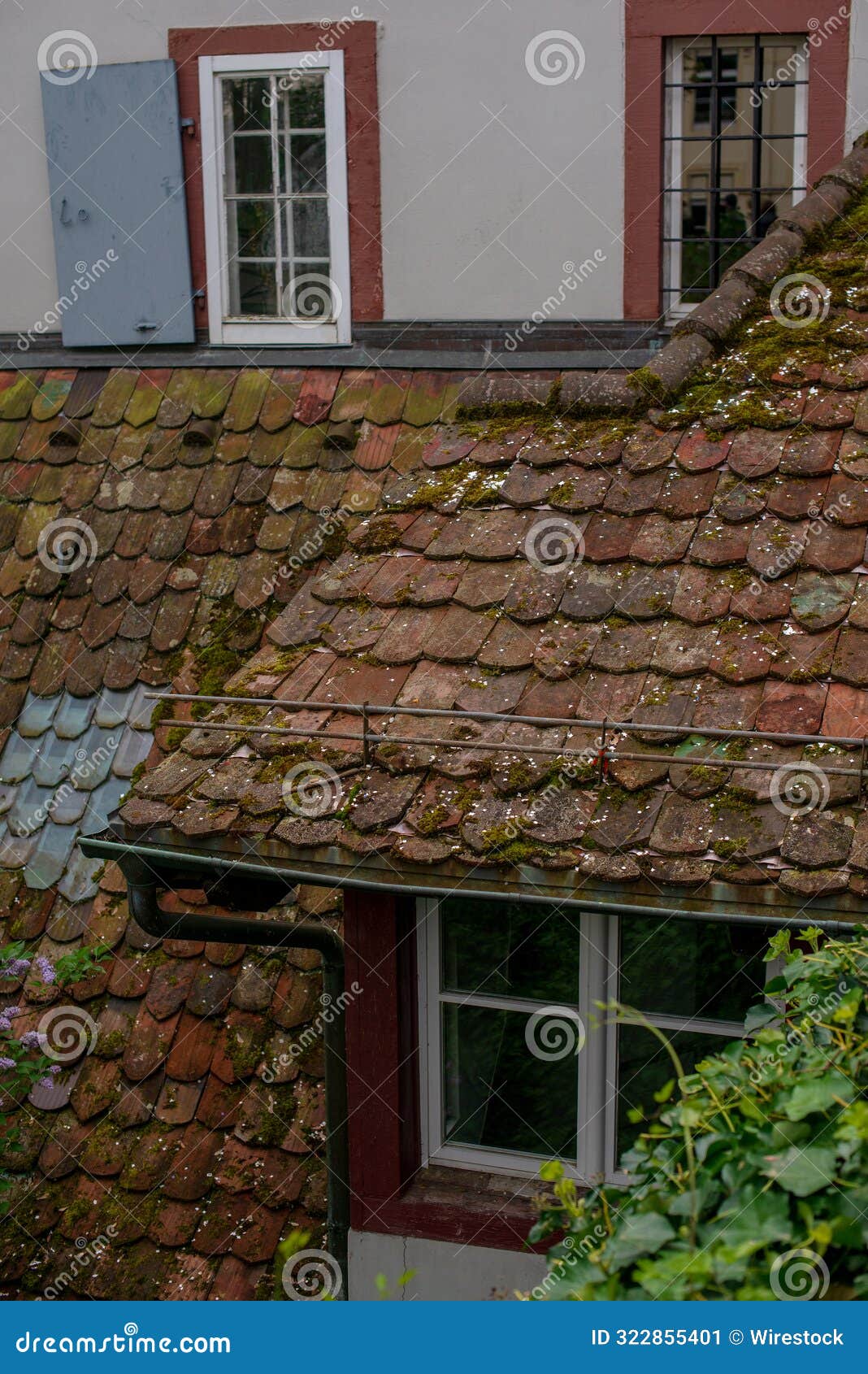 Vintage Building with Tiled Roof and Arched Windows Stock Image - Image ...