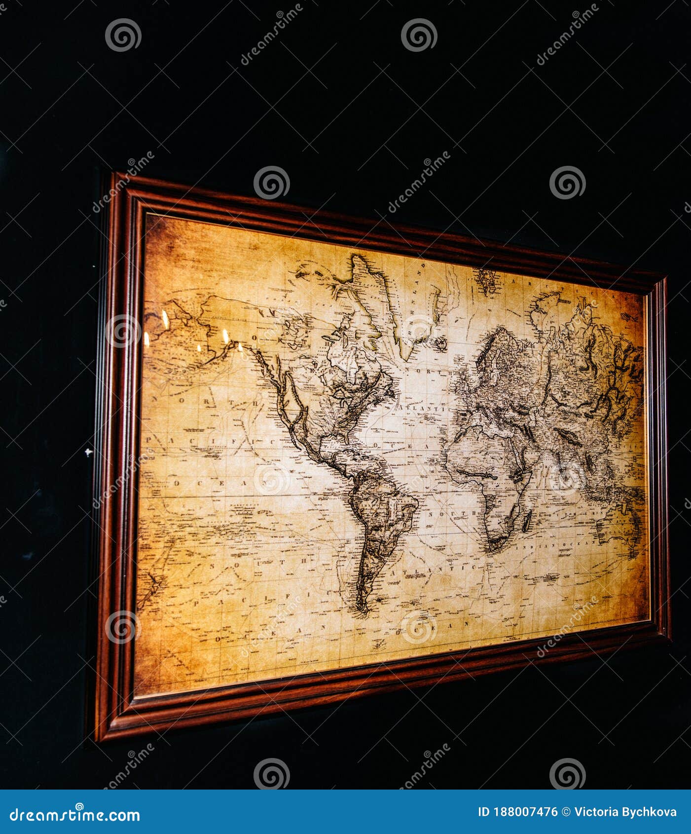 Vintage Burnt World Map in a Frame on a Black Wall. Interior Element ...