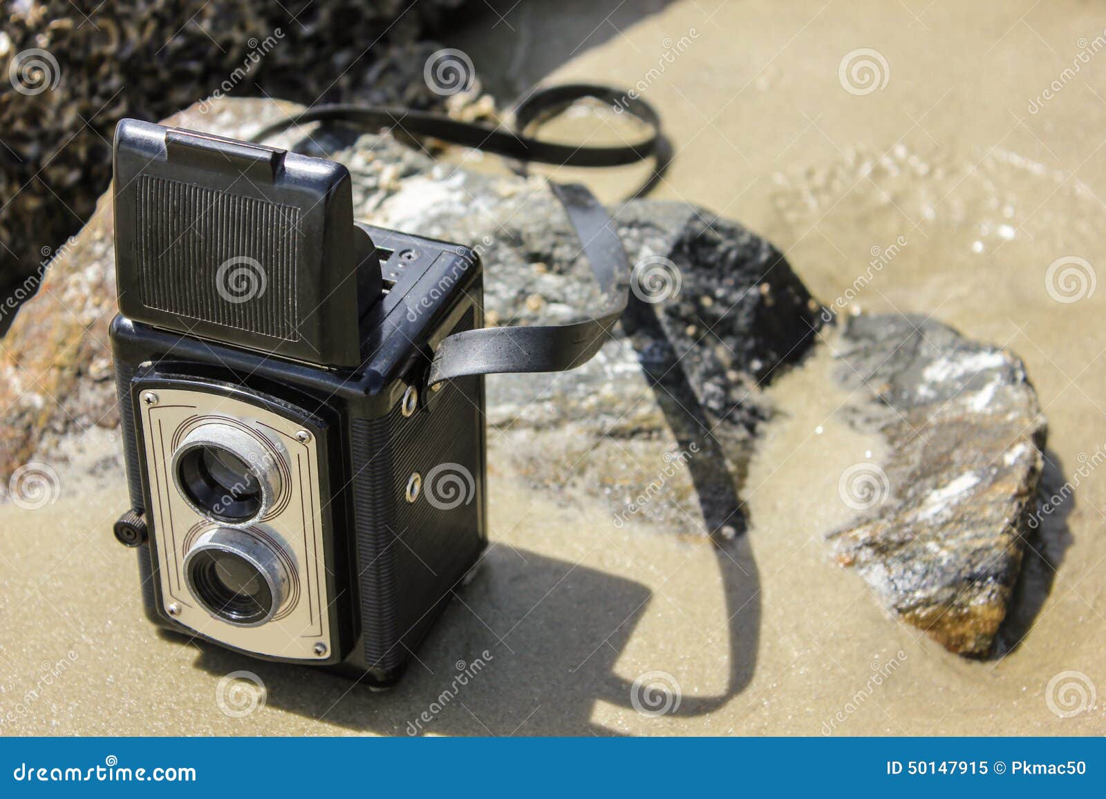 Vintage camera on beach stock image. Image of rocks, sandy - 50147915