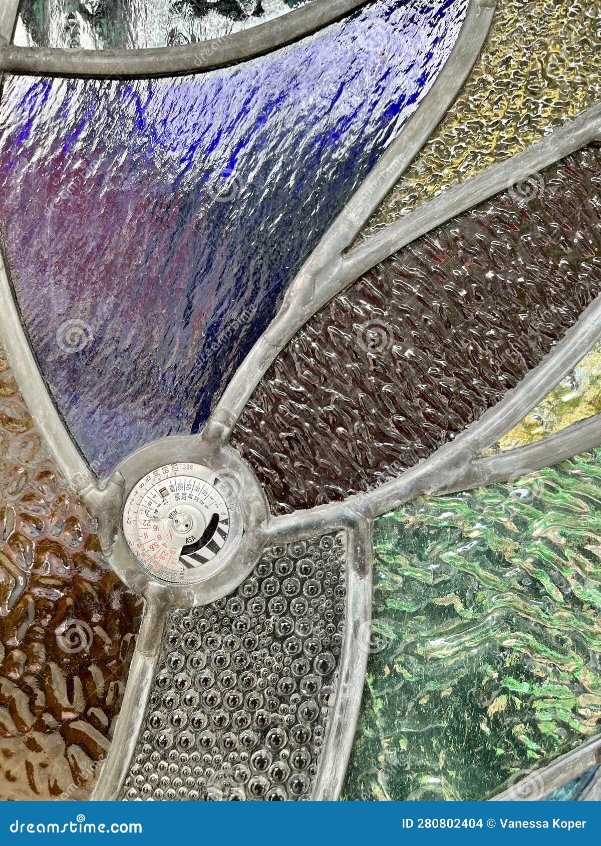 A Vintage Camera Lens in a Stained Glass Door Stock Photo - Image of ...