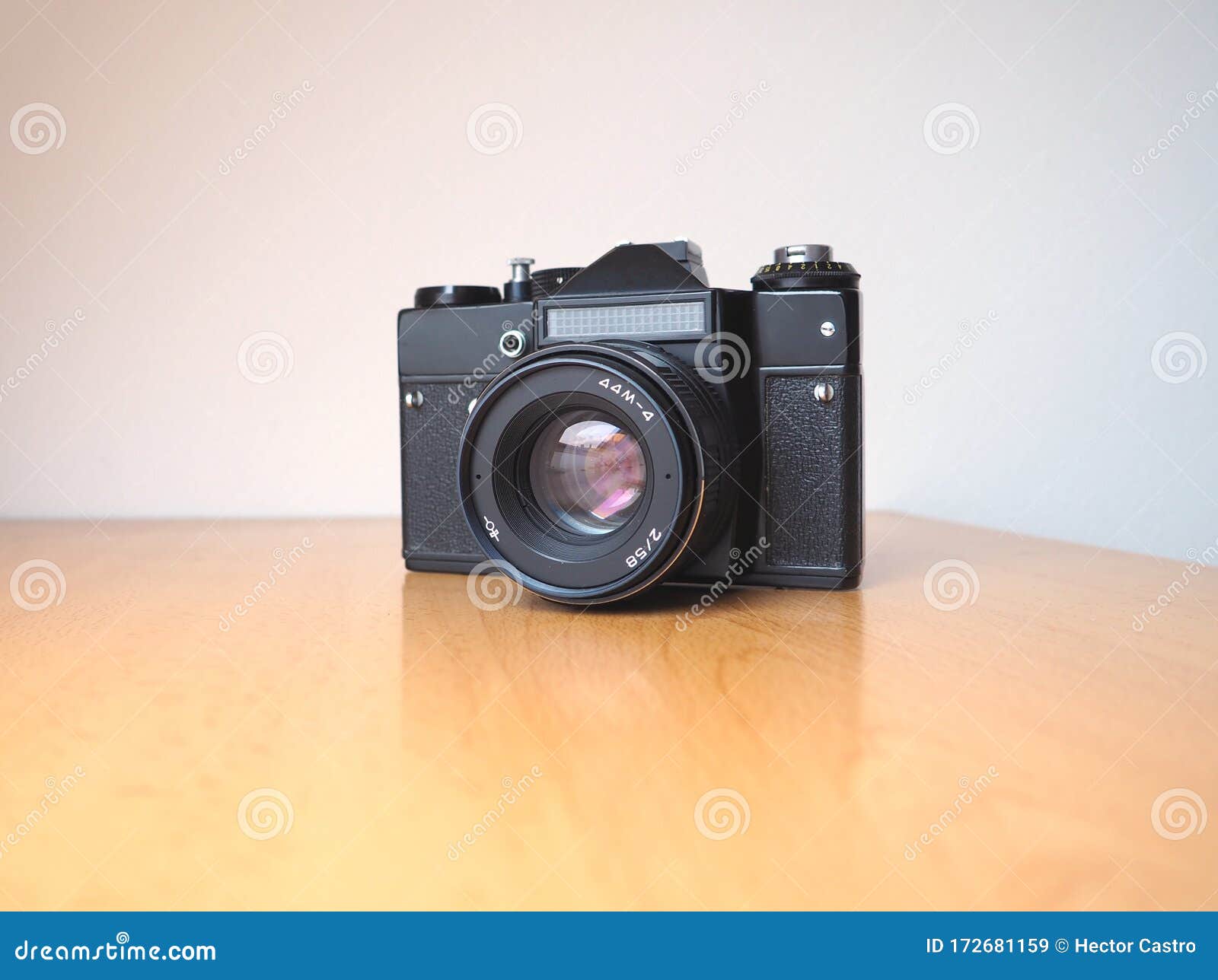 Vintage camera on a table stock image. Image of wall - 172681159