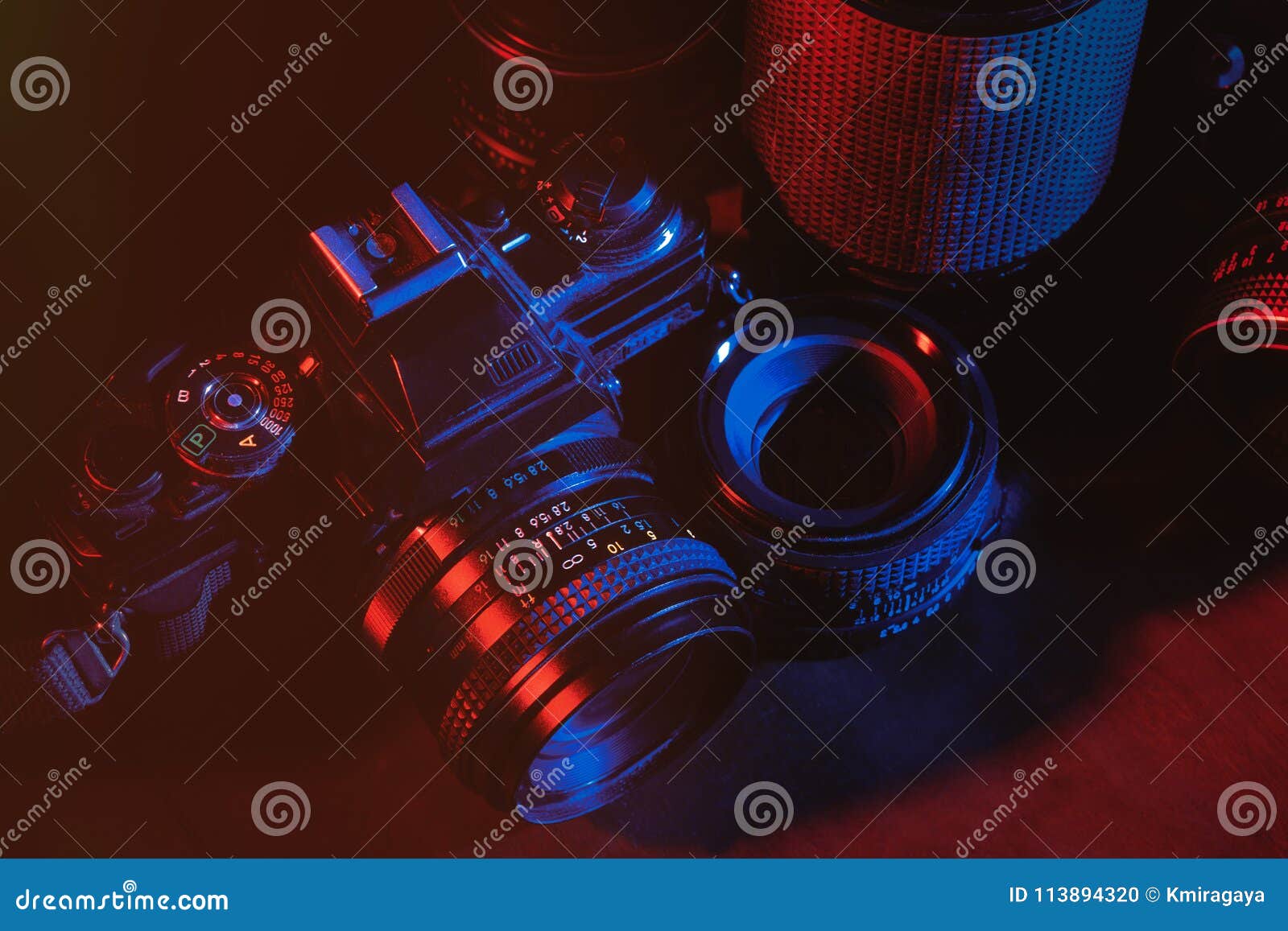 Vintage Cameras and Lenses Illuminated in Red and Blue Stock Photo ...