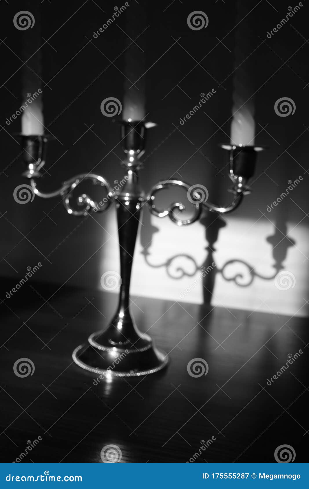 Vintage Candlestick with Three Candles on the Table. Shadow Reflection ...