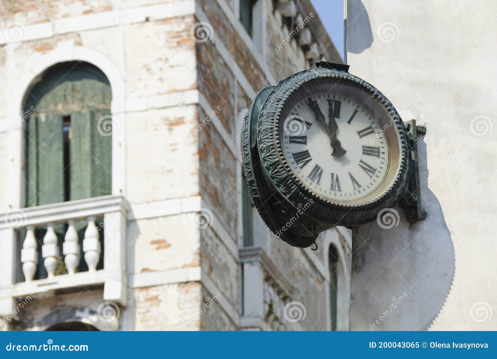Vintage Clock Hanging Outside on the Corner of the House Stock Image ...