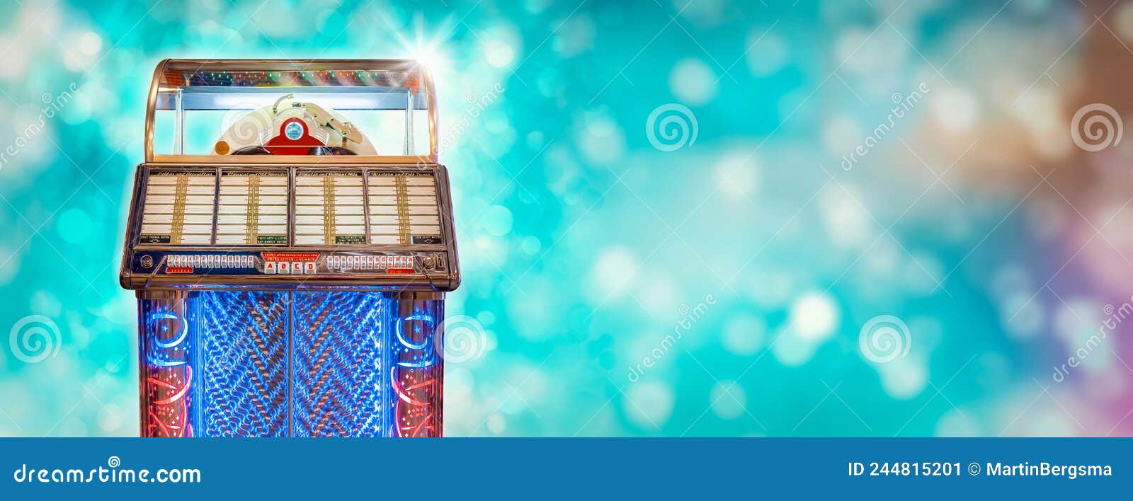 Retro Colorful Jukebox in Front of Blue Background with Bokeh Stock ...