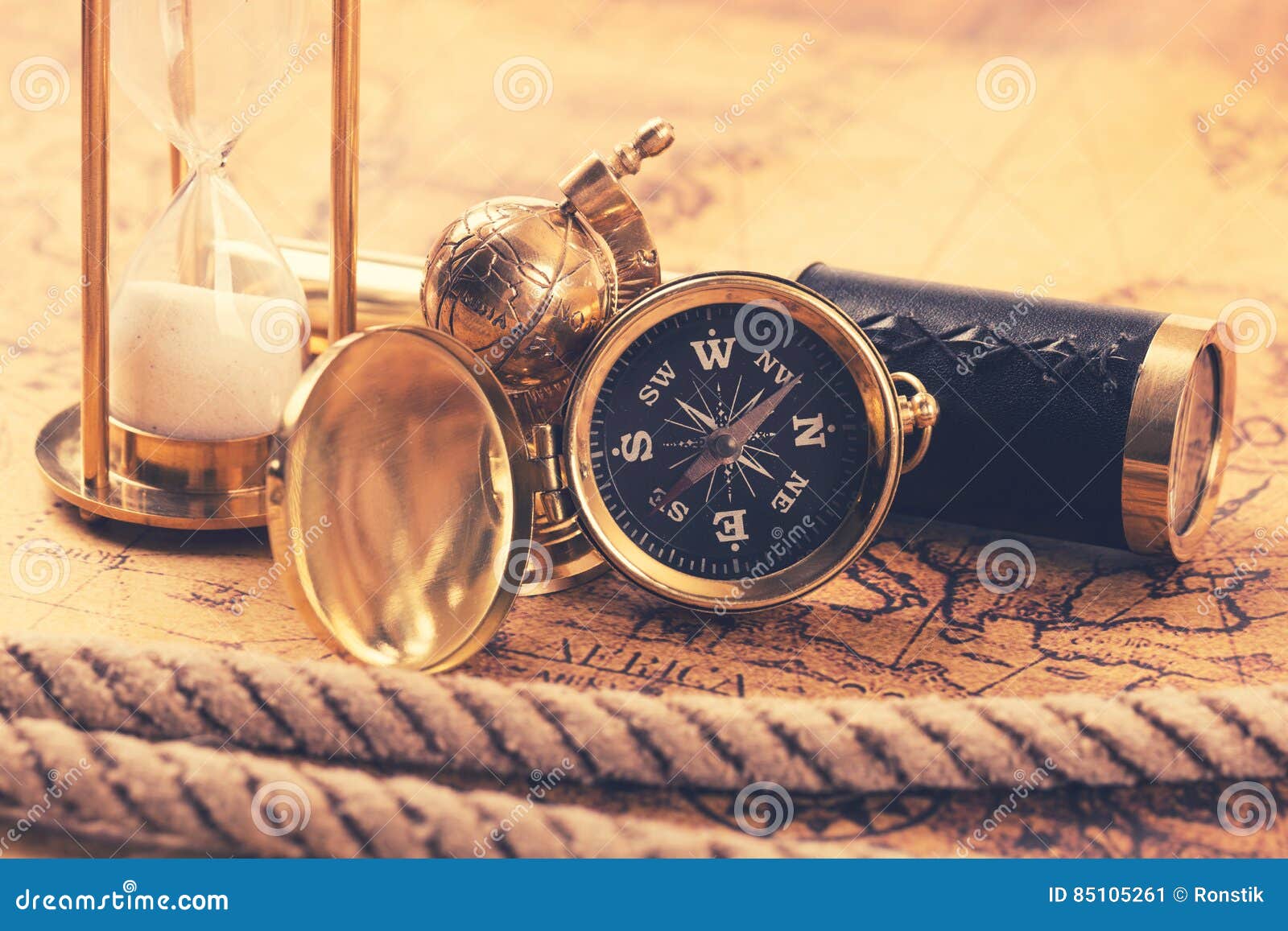 Vintage Compass and Nautical Items on Ancient World Map Stock Image ...