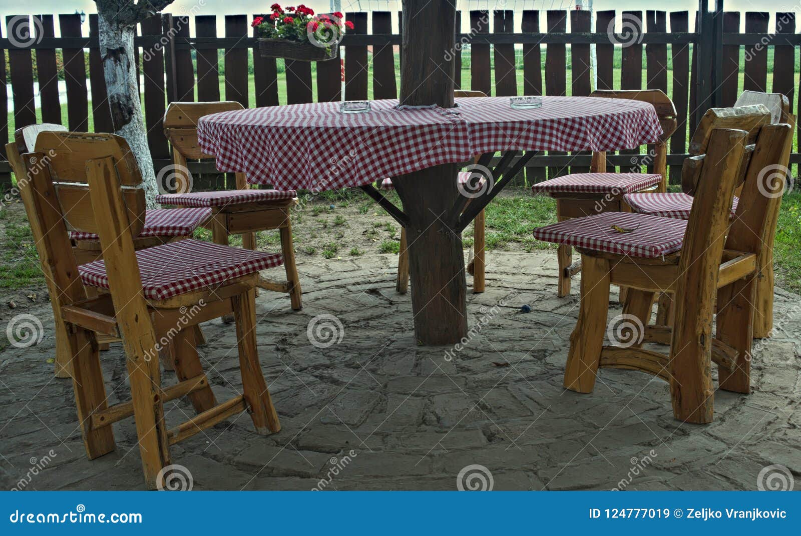 Vintage Designed Table and Chairs in Front of Fence in Backyard Stock ...