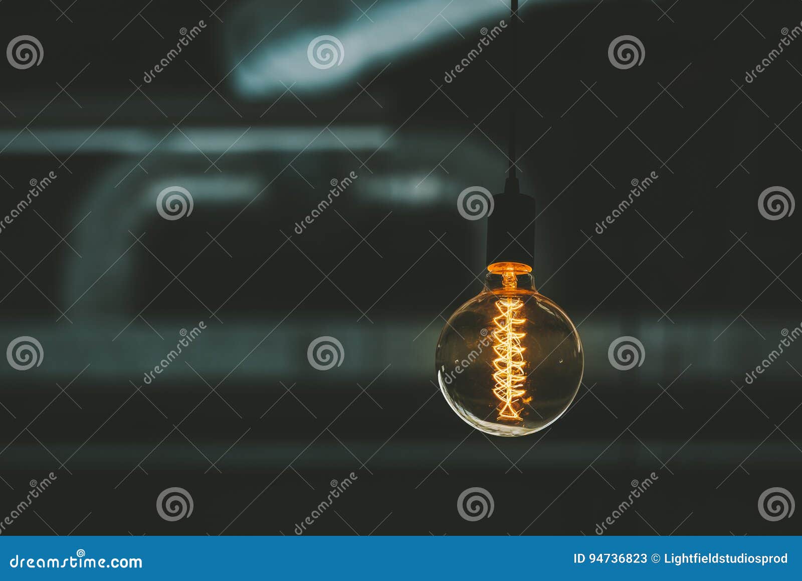 Vintage Edison Light Bulb Hanging in Dark Room Stock Image - Image of ...