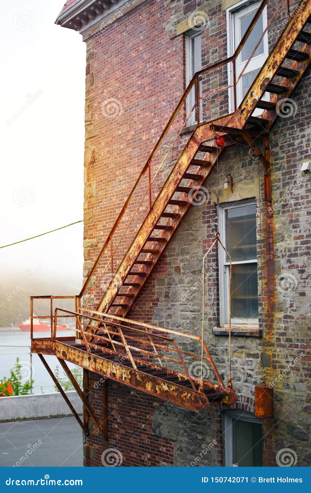 Vintage Fire Escape Stairs on Brick Building in Sunshine Stock Image ...