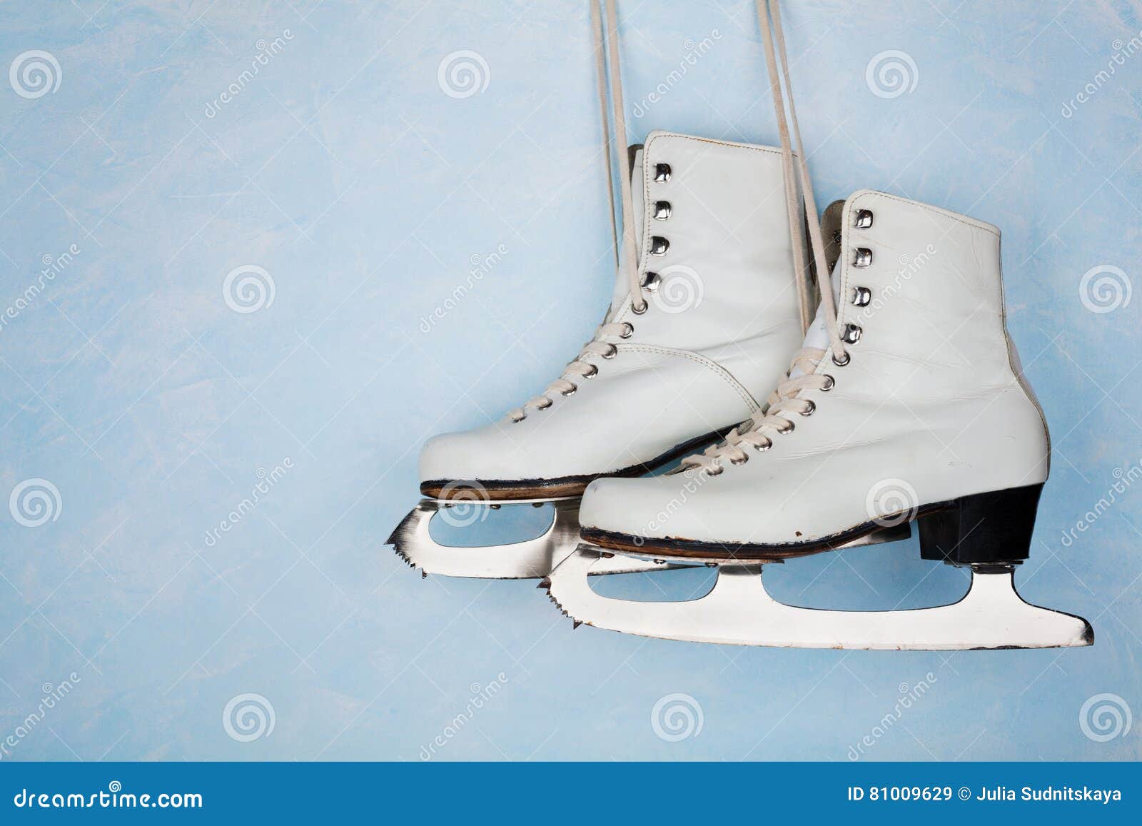 Vintage Ice Skates for Figure Skating Hanging on the Background of Blue ...