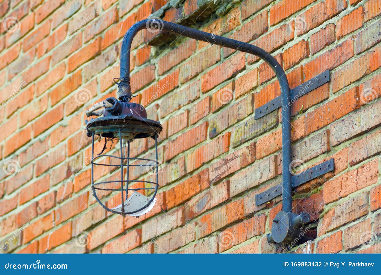 Vintage Industrial Broken Lantern on a Brick Wall Stock Photo - Image ...