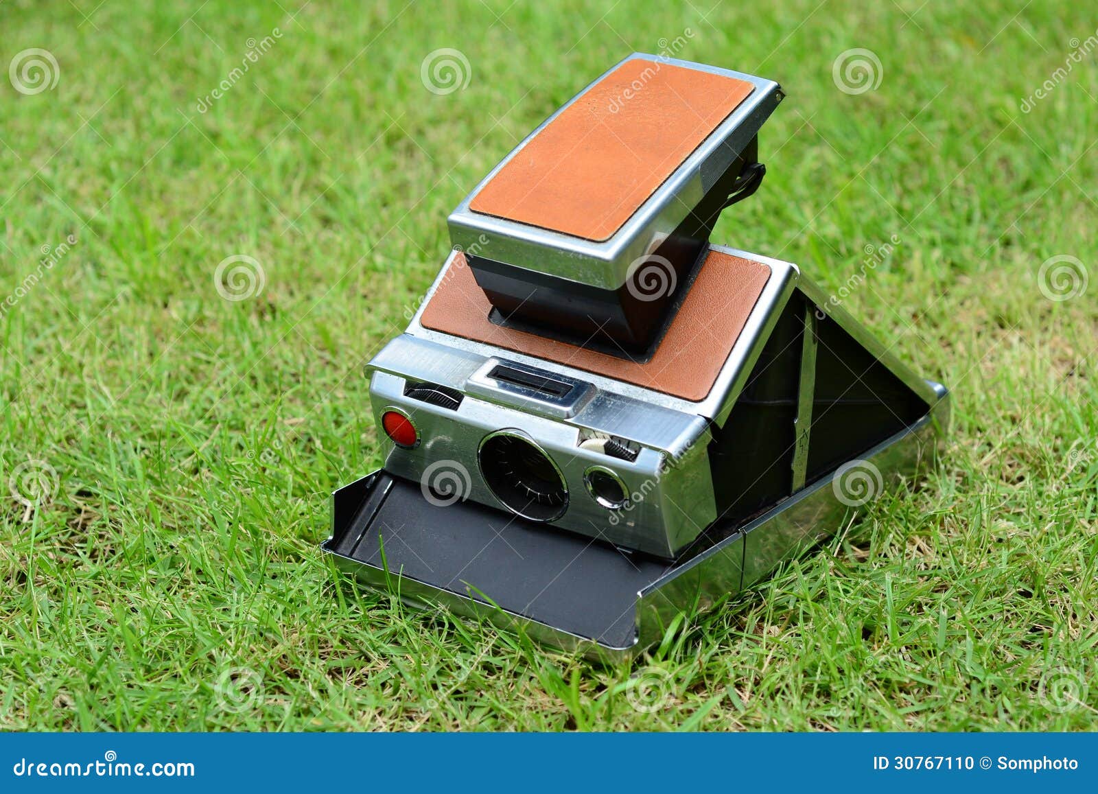 Vintage Instant Camera on Green Grass Stock Photo - Image of camera ...